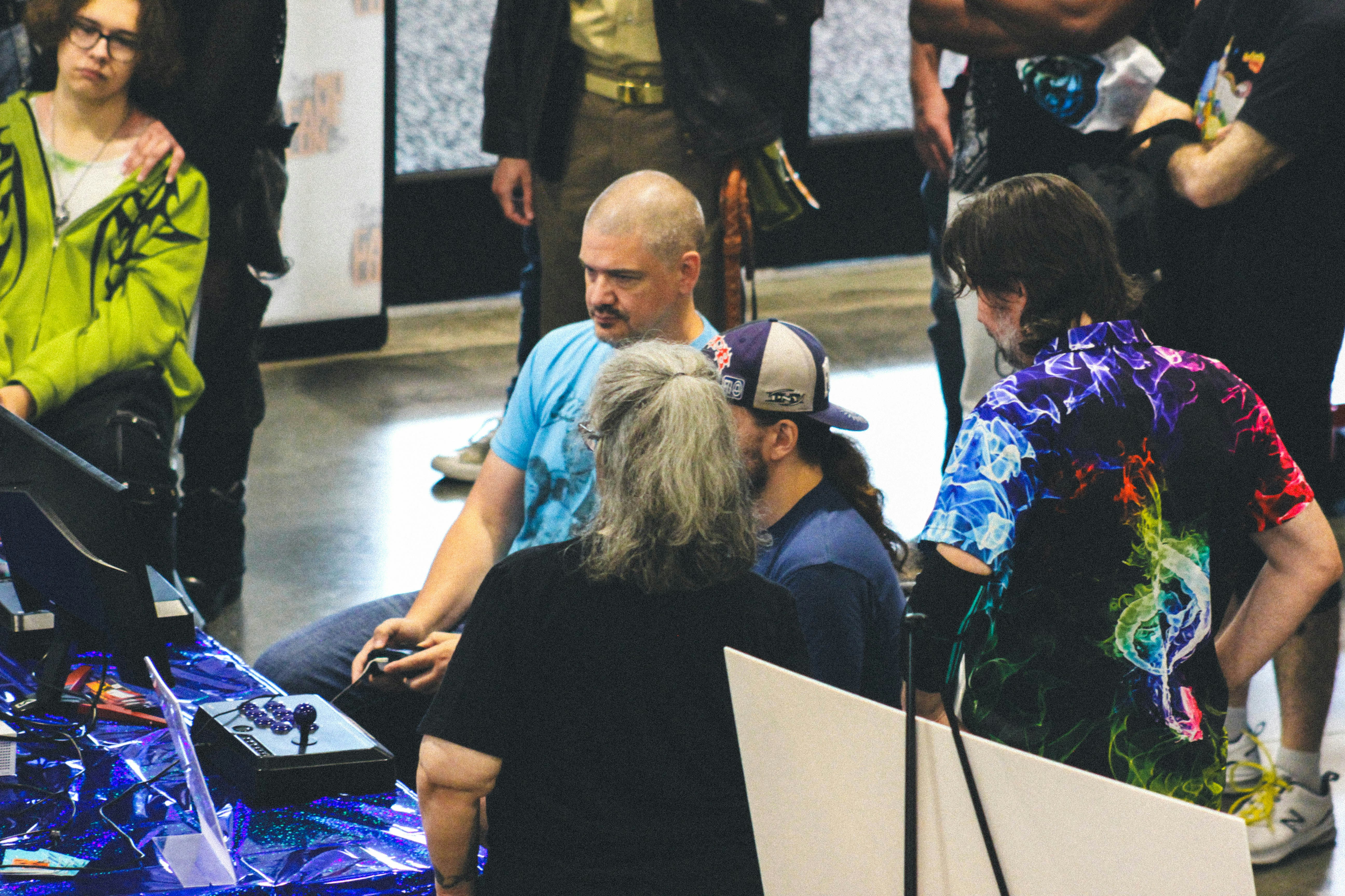 Mid-conversation at a crowded convention booth