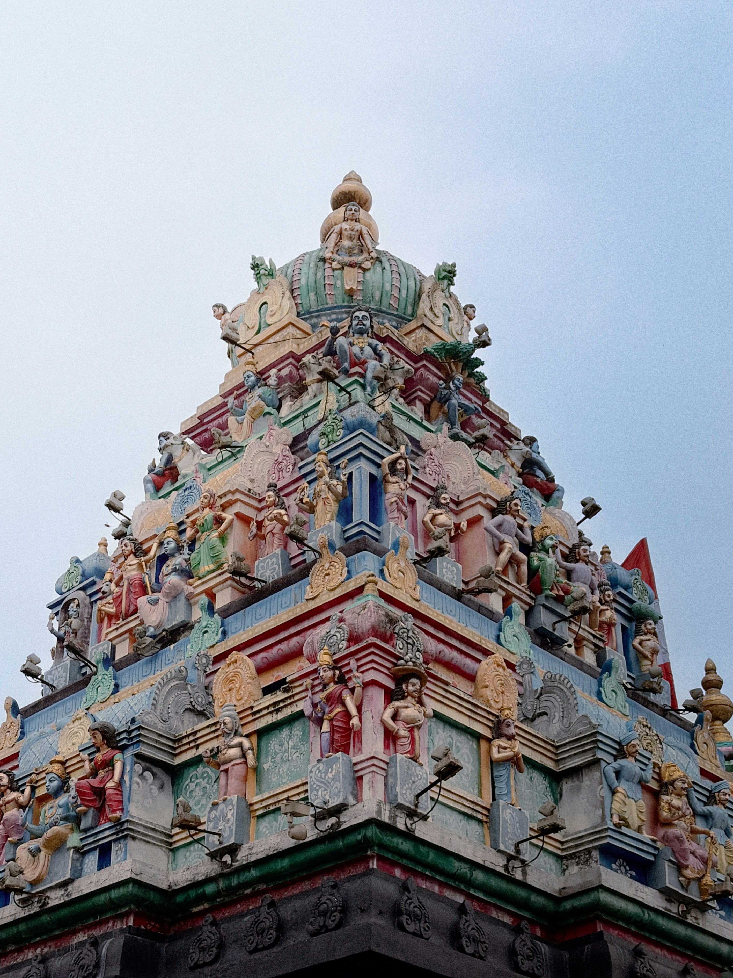 Tiered Dragon-Headed Shikhara: A Sculpted Tapestry of Color