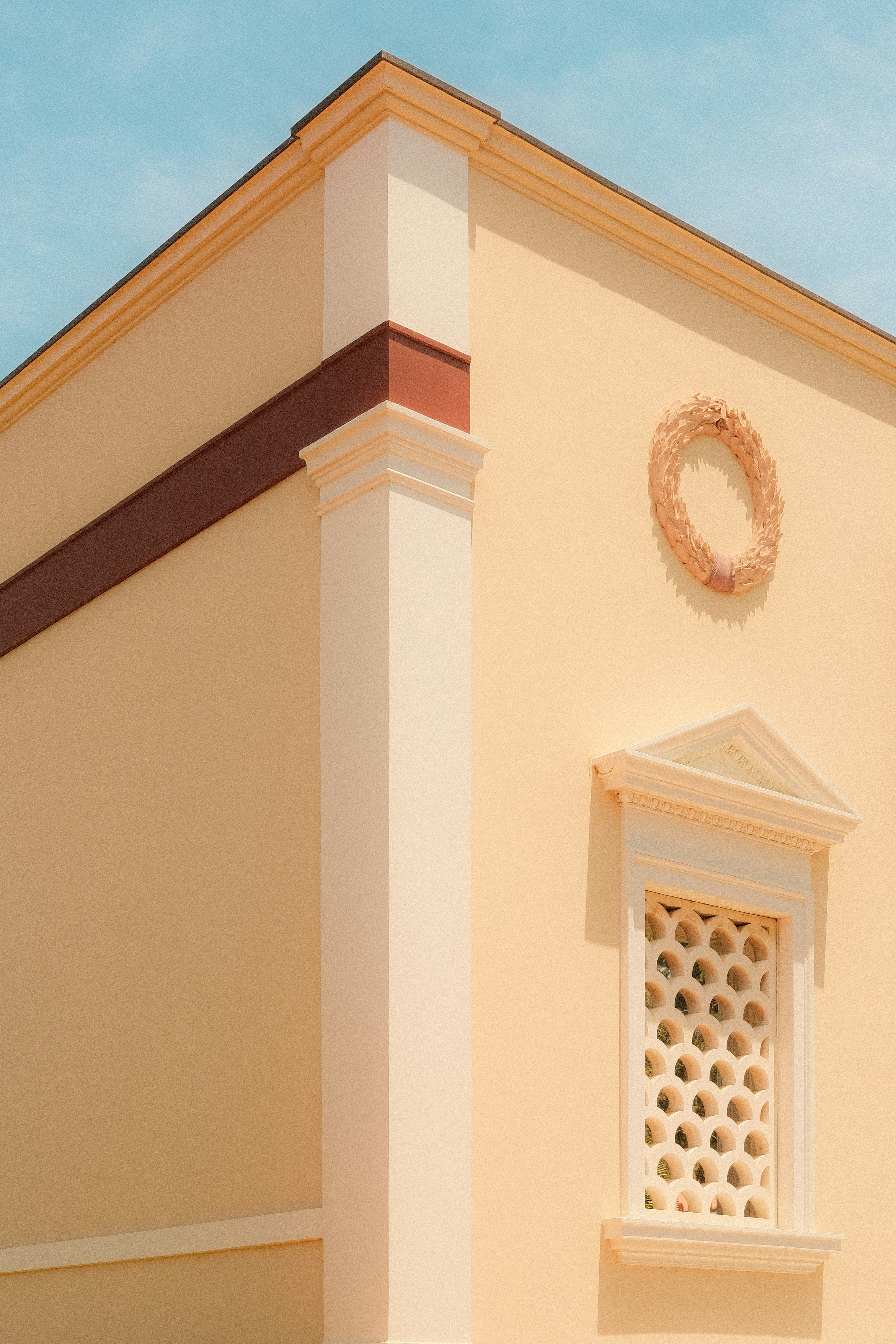 Sunlit Cornice: Minimal Geometry on a Warm Facade