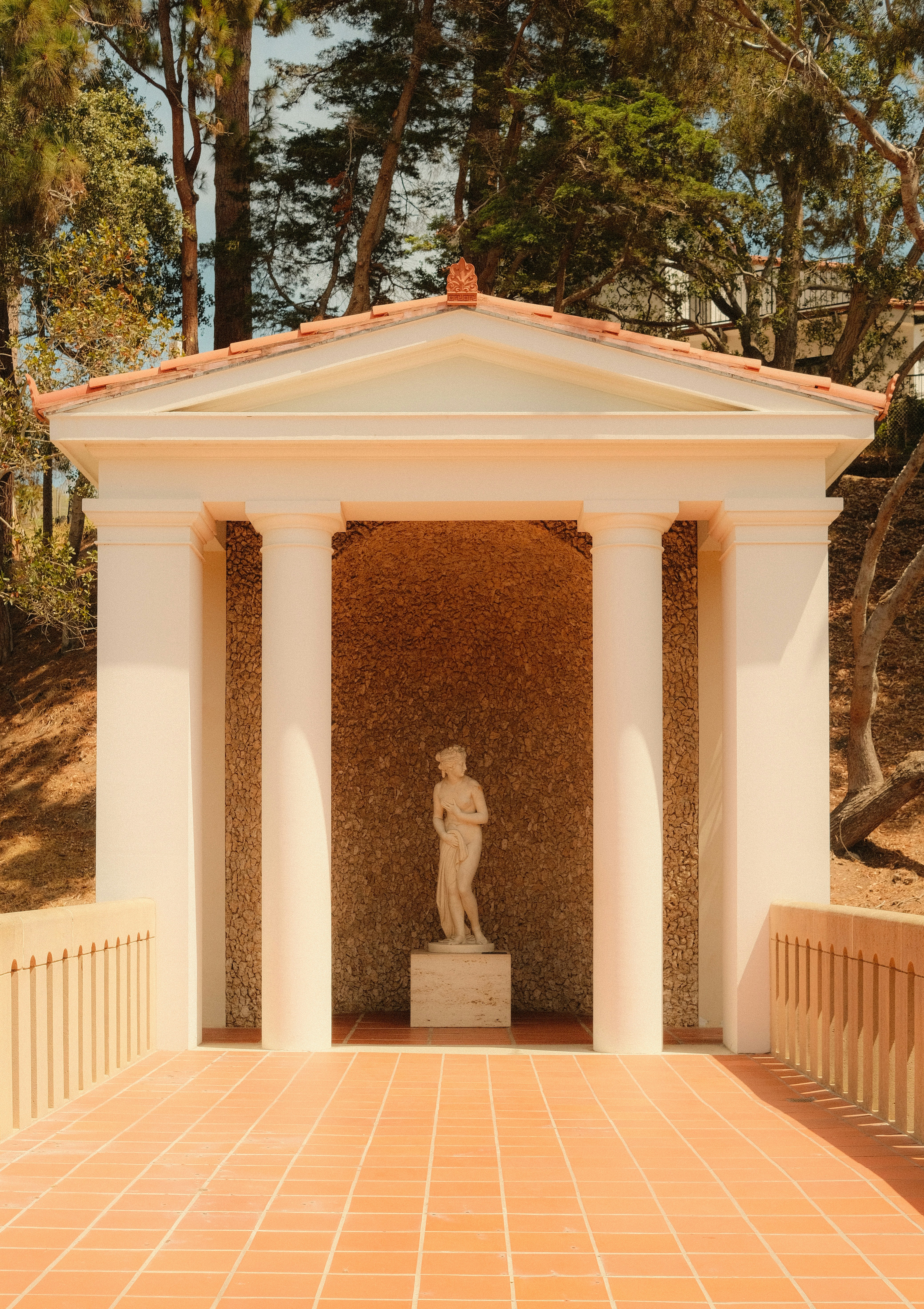 Temple of the statue: sunlit pavilion with classical columns