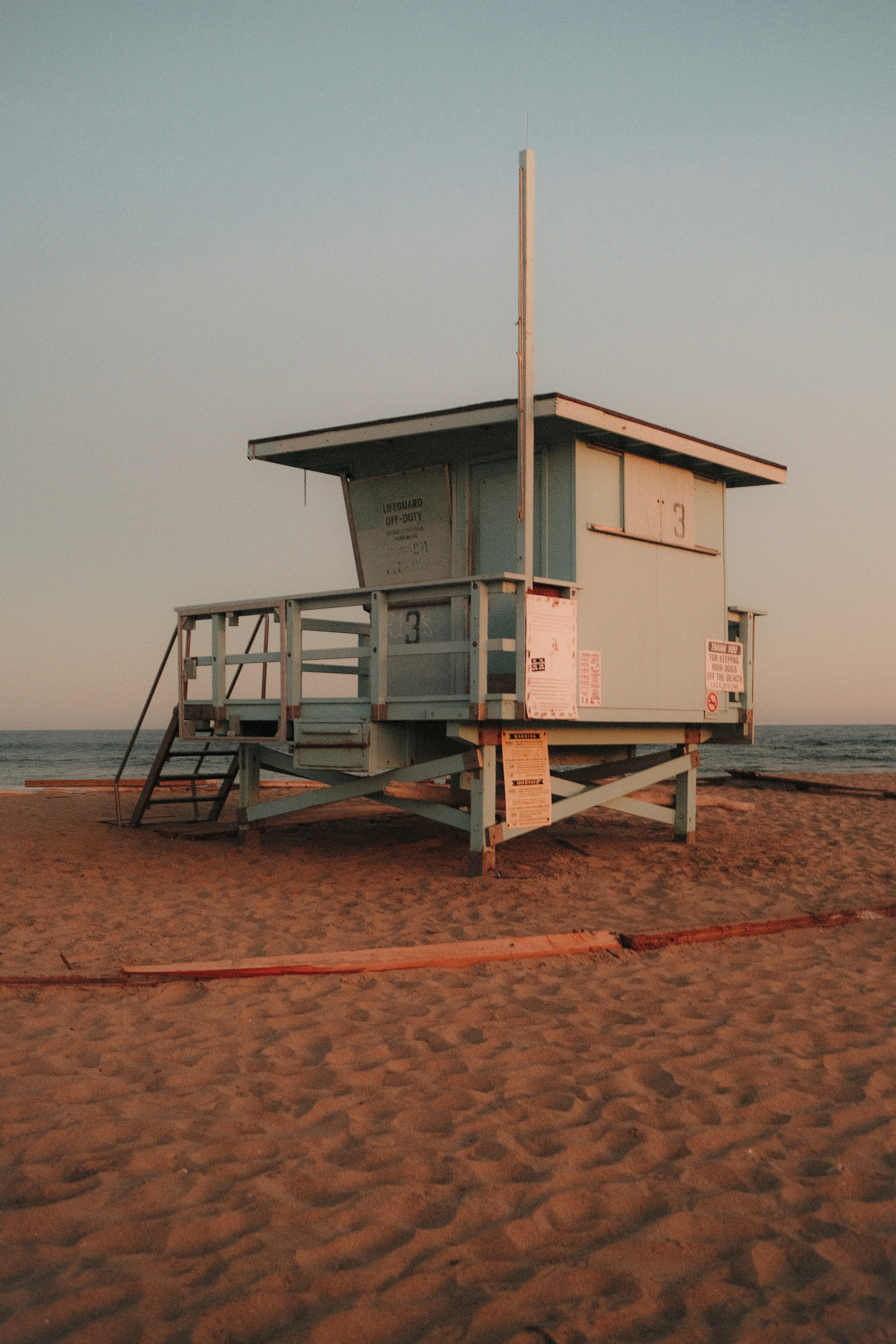 Lifeguard’s Post at Dusk: A Quiet Sentinel on the Beach