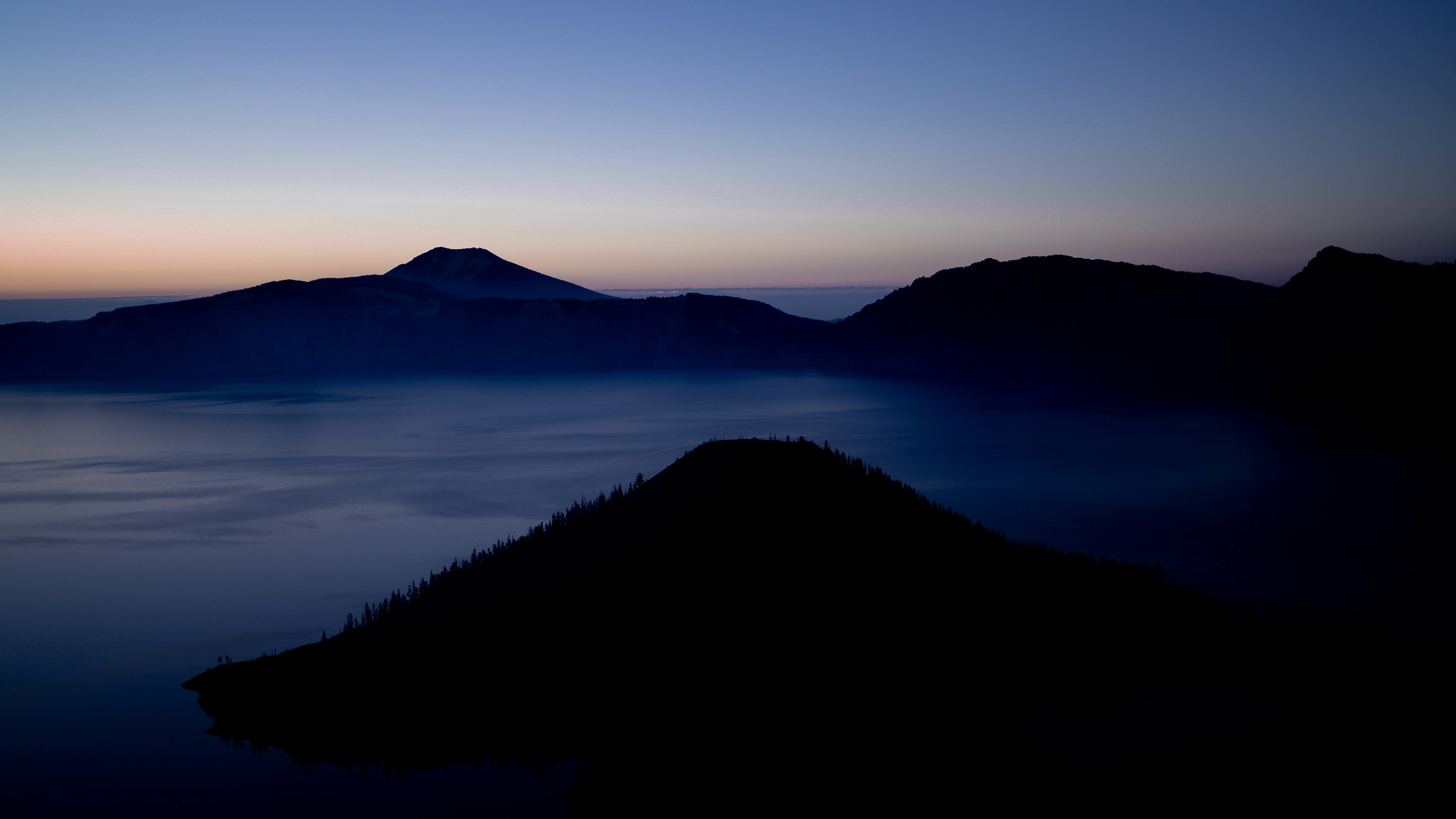 Dawn over Shrouded Peaks: A Quiet Ocean of Night and Mist