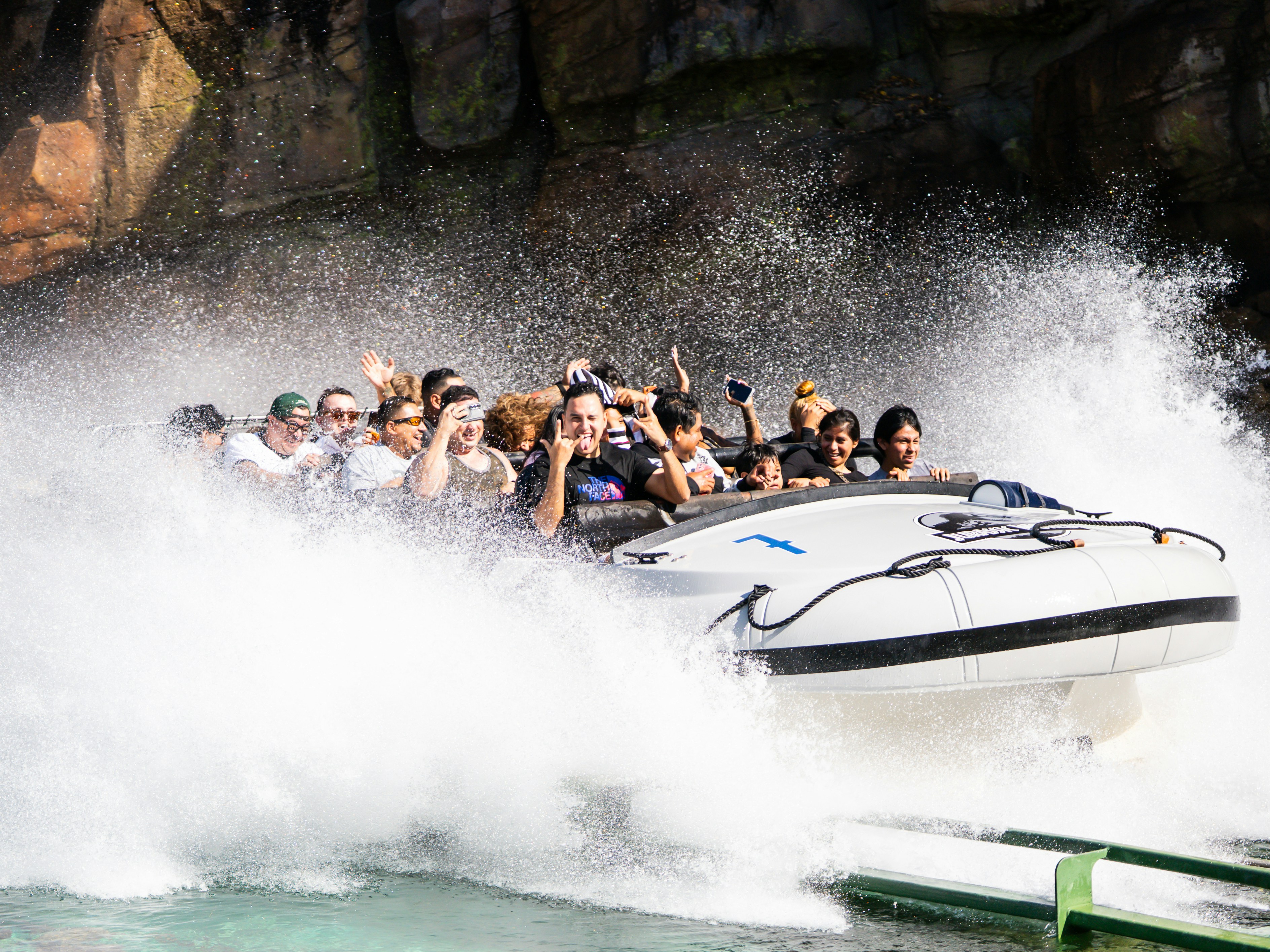 Raging Whitewater Express: A Wave-Engulfed Speedboat Full of Thrill-Seekers