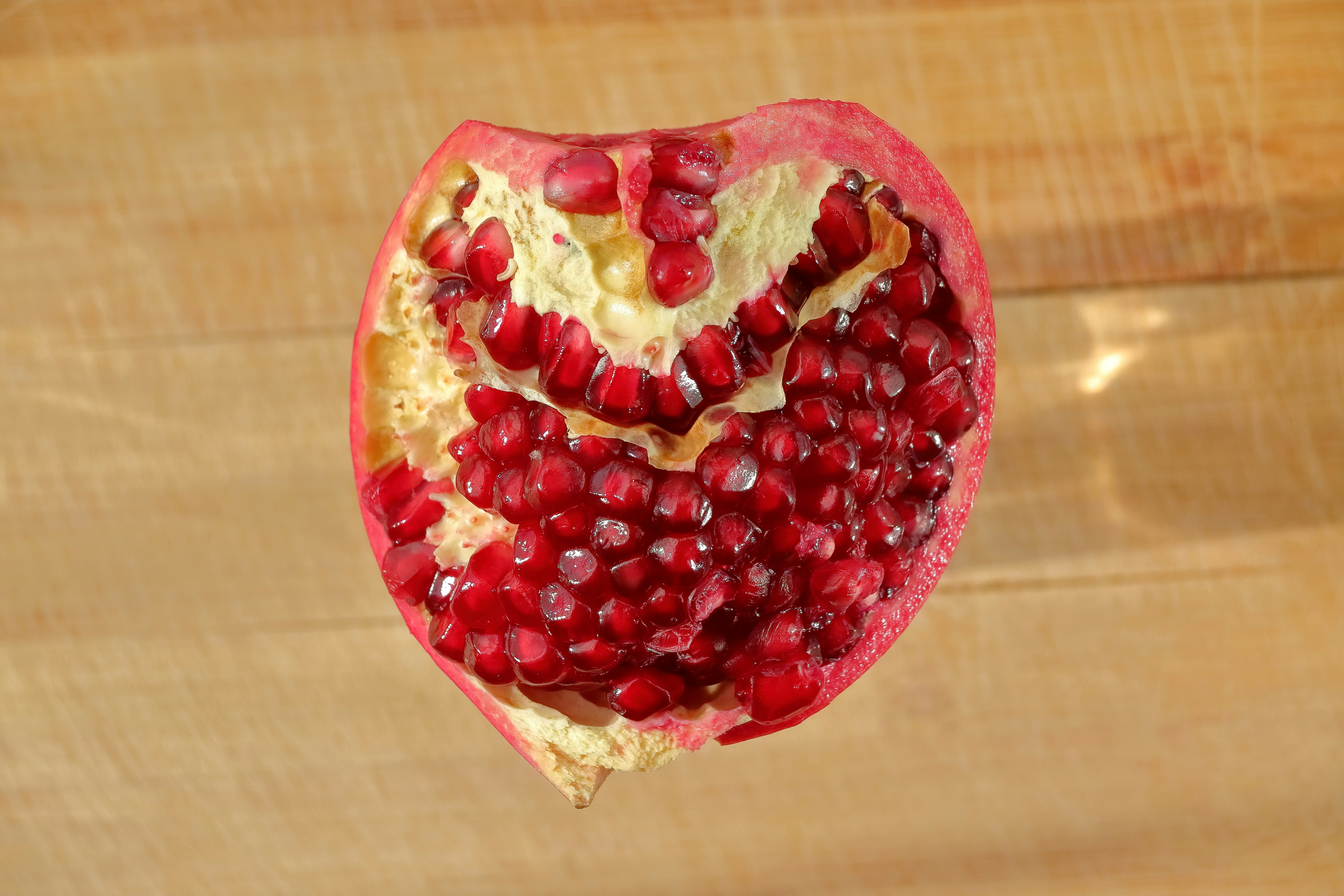 Pomegranate Crown: Cross-section Spotlight on Juicy Seeds