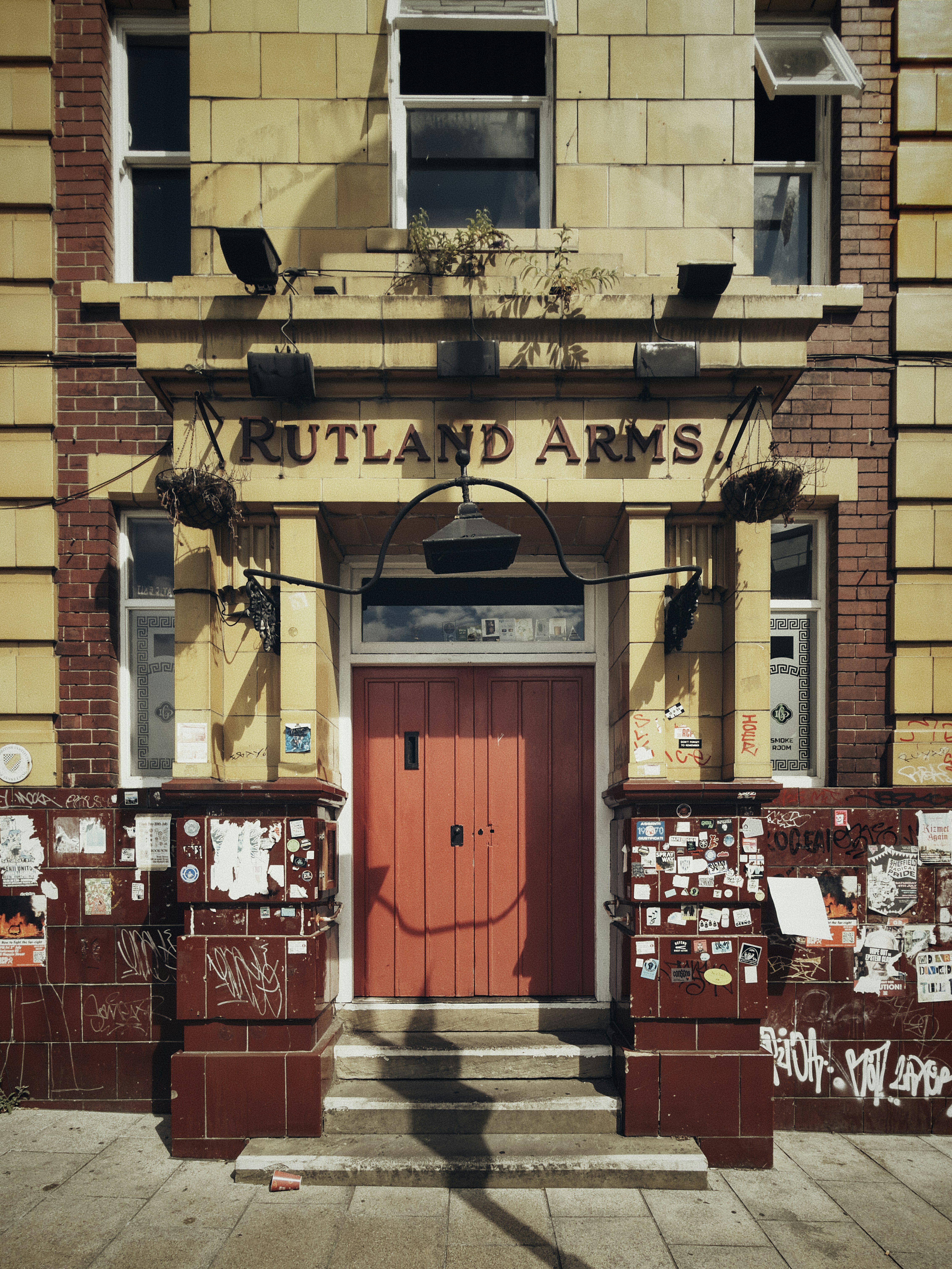 Red Door, Quiet Steps: An Urban Facade of Rutland Arms