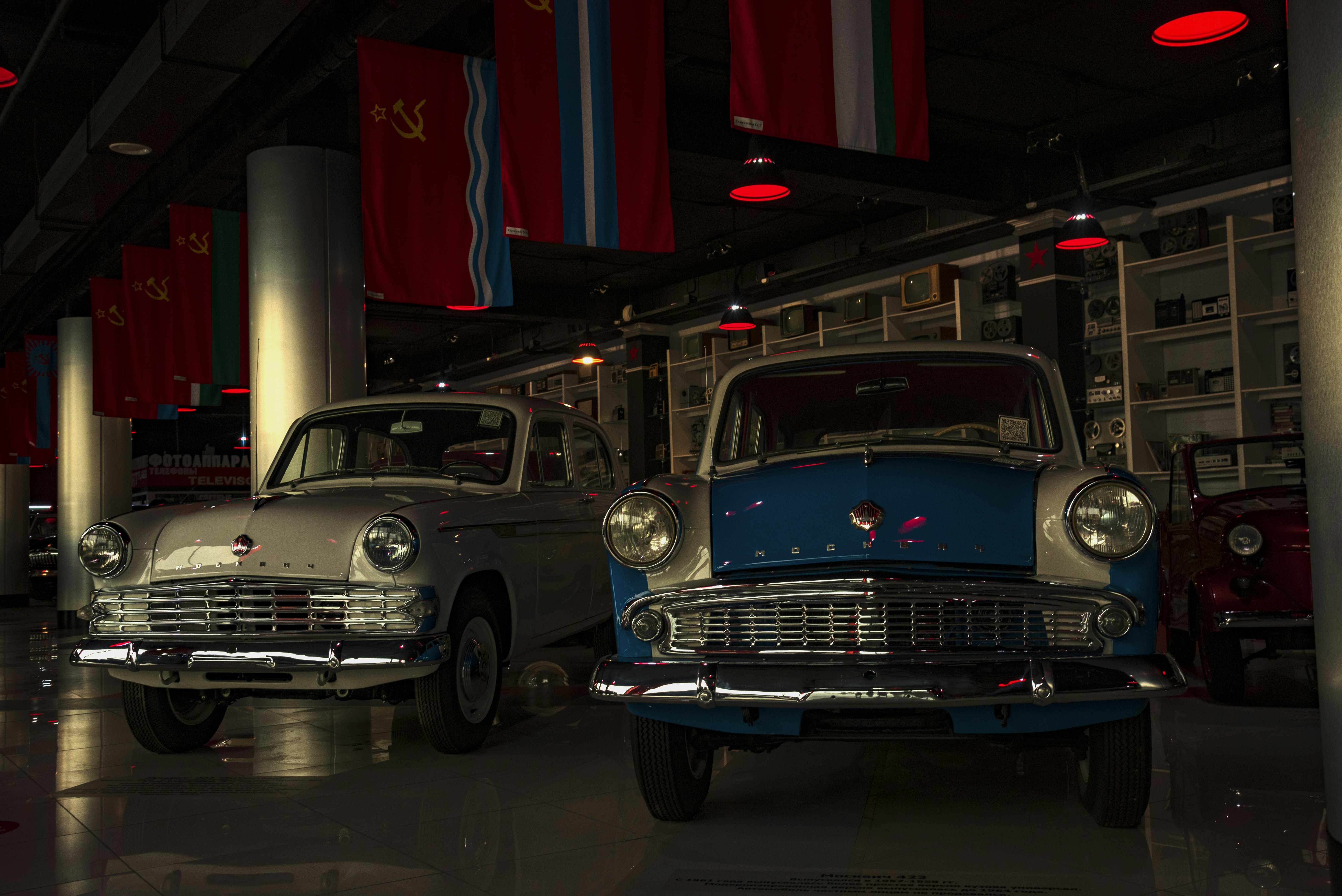 Two Classic Cruisers Await in a Vintage Car Den