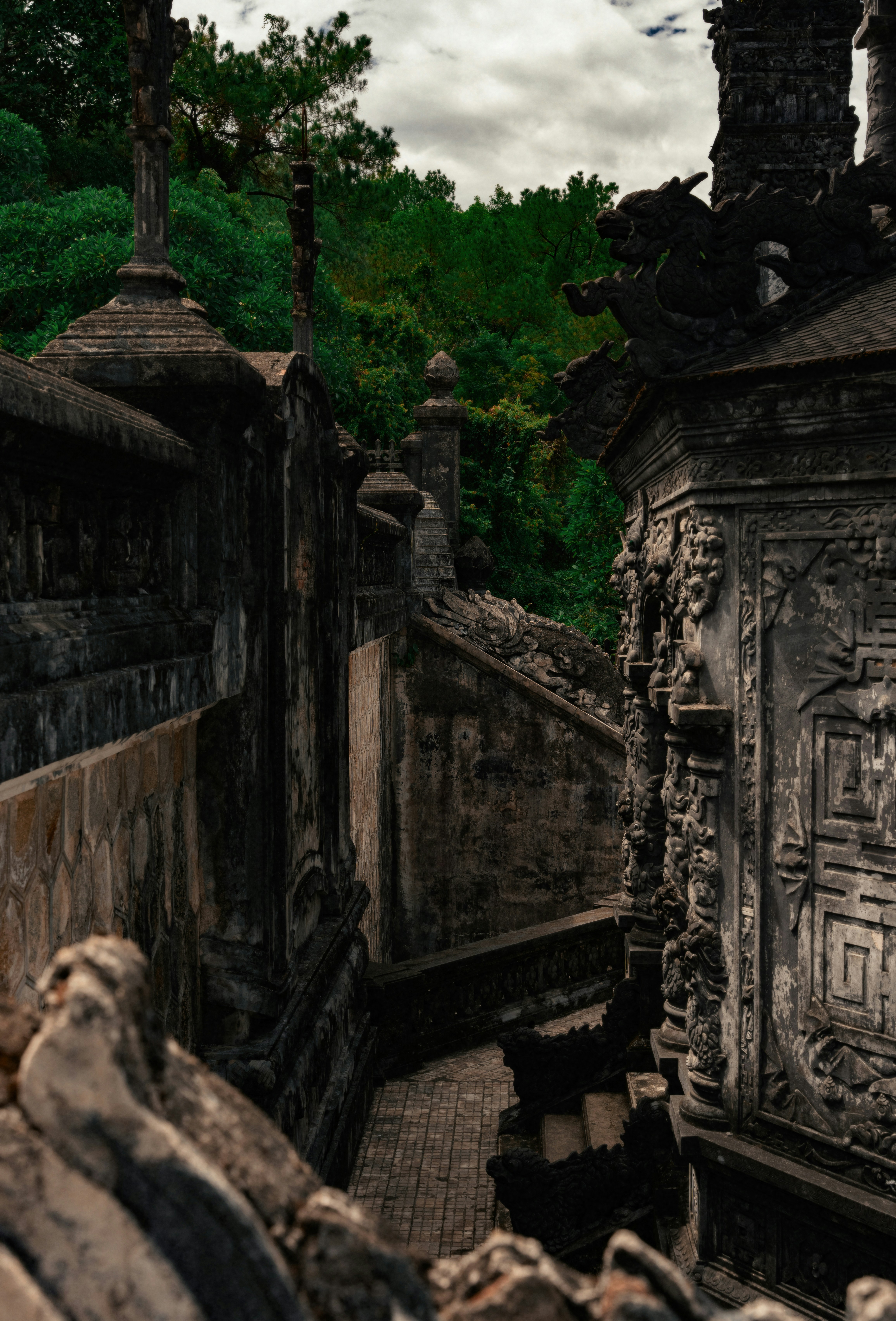 Carved Gateways and Overgrown Steps of an Ancient Vietnamese Temple