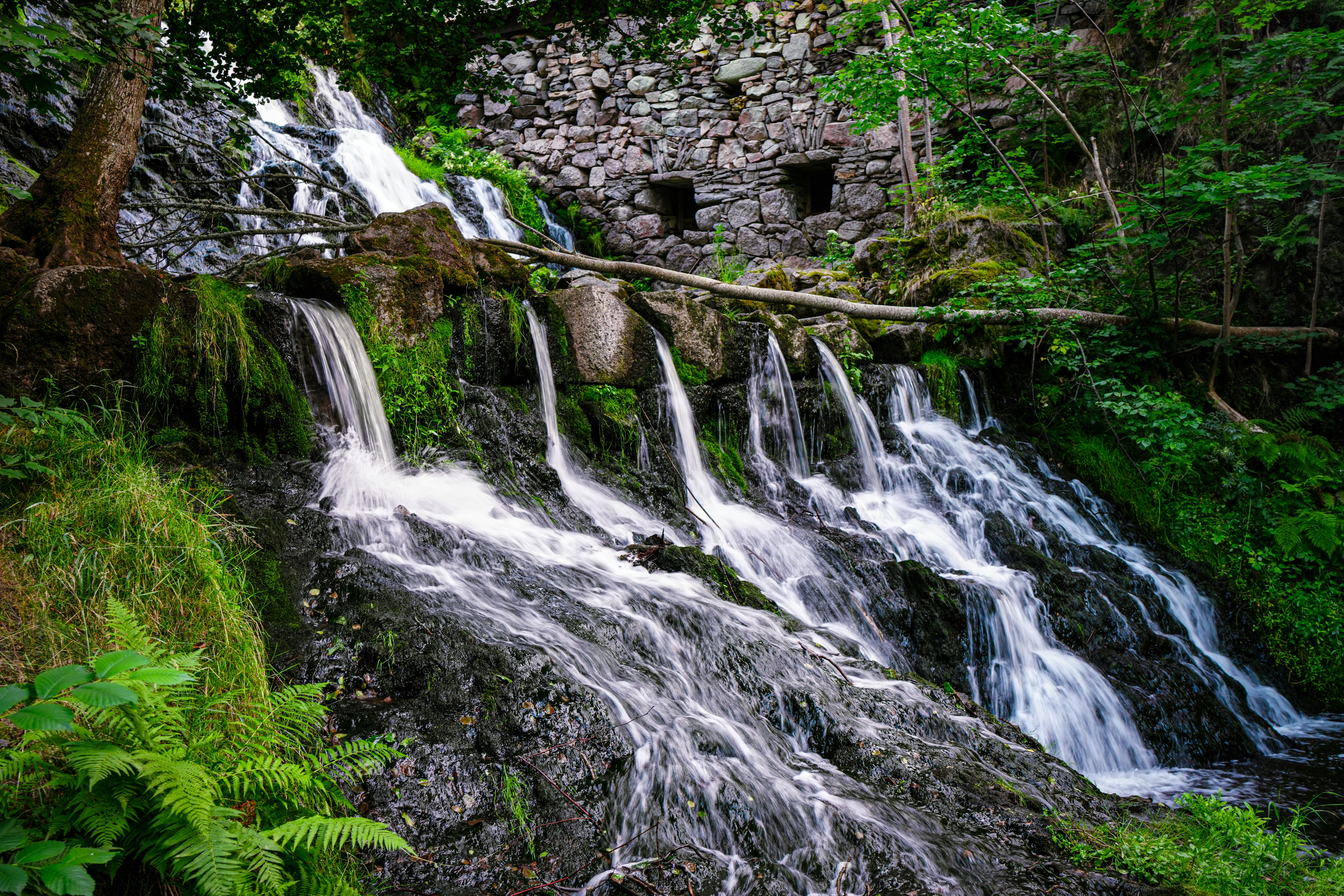 Waterfall Mosaic under a Stone Bridge