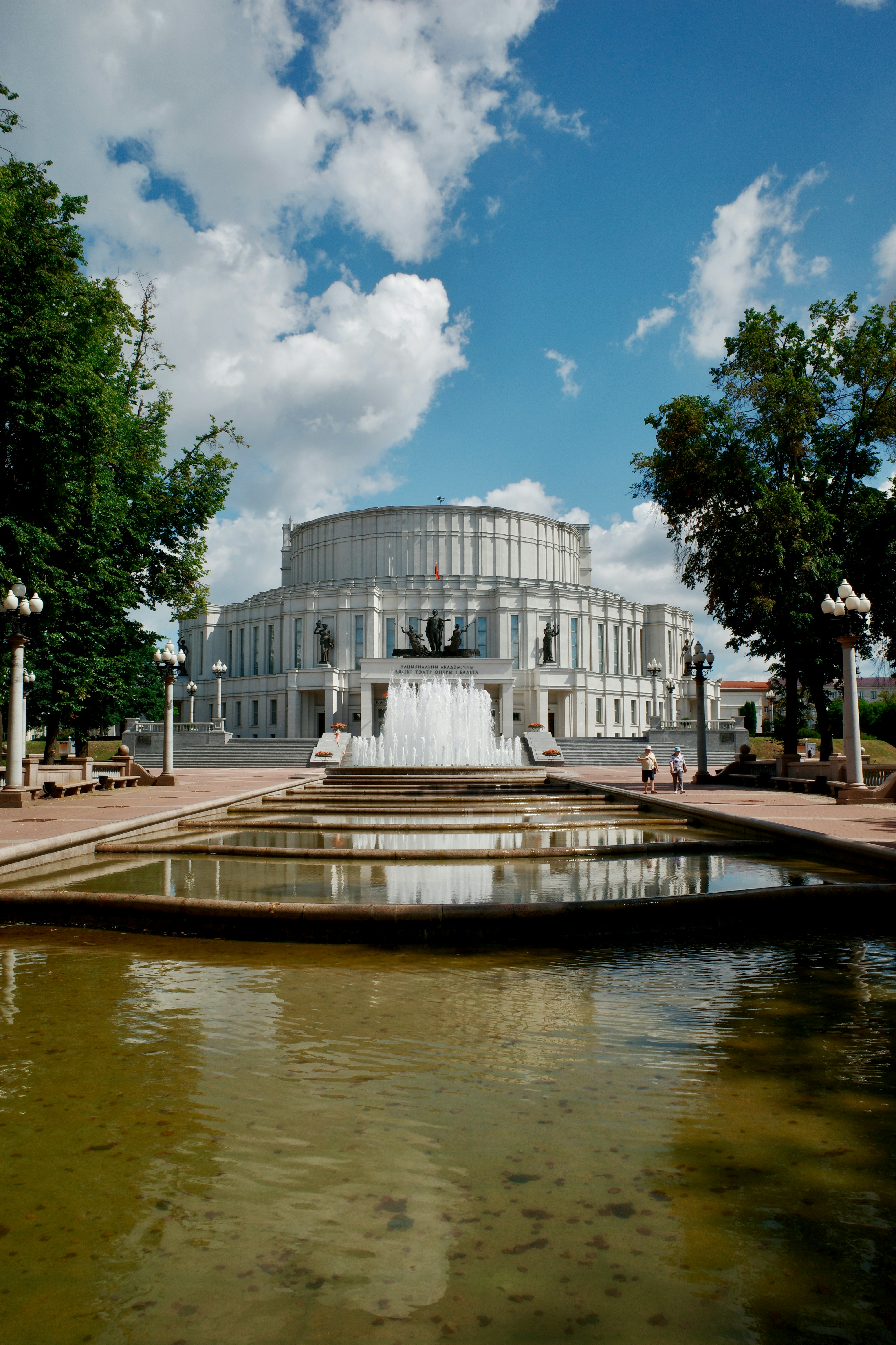 Symmetrical Civic Grandeur: Fountain, Step-Pyramid, and Morning Sky