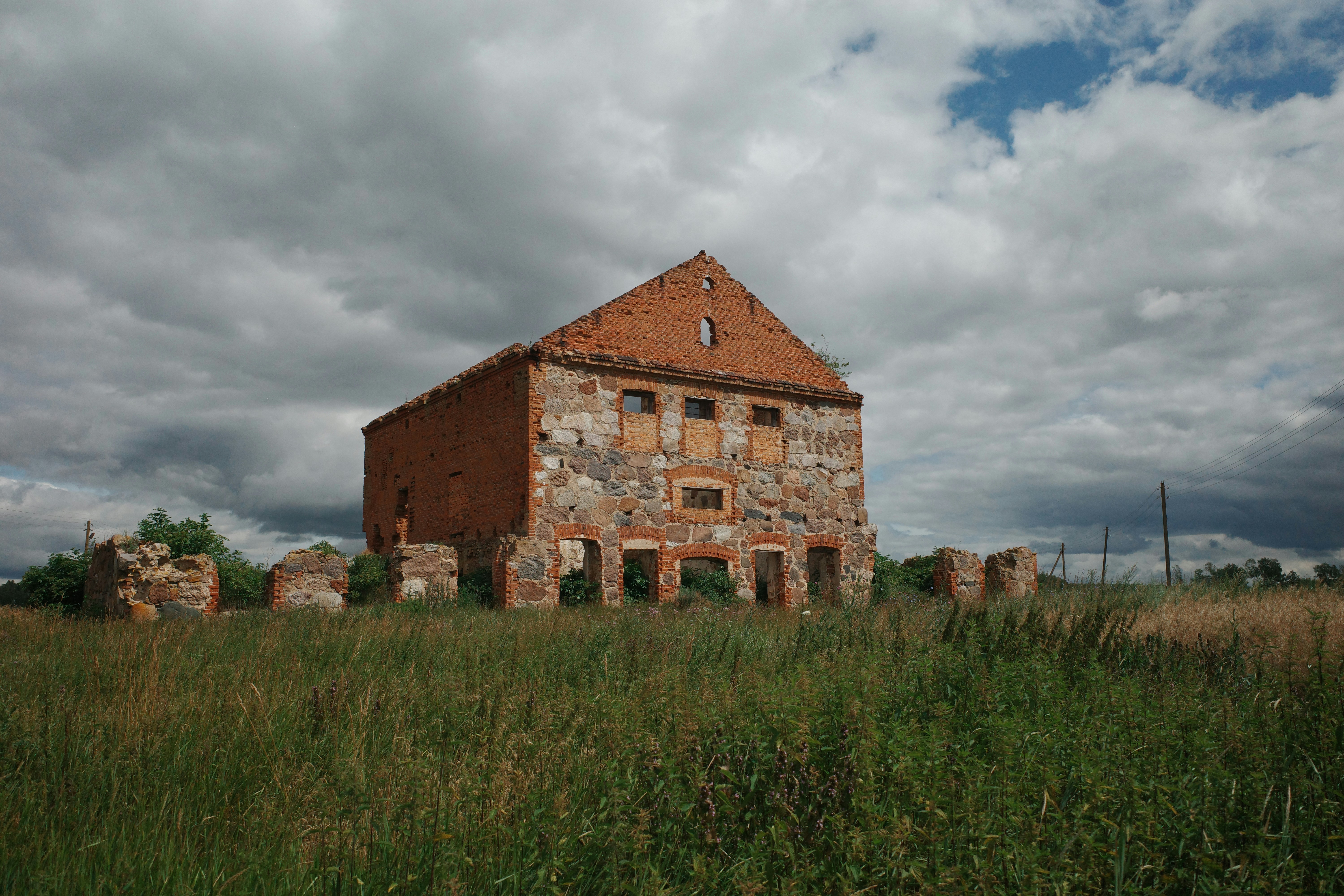 Ruin in the Prairie: Brick House Standing Against a Wide Sky
