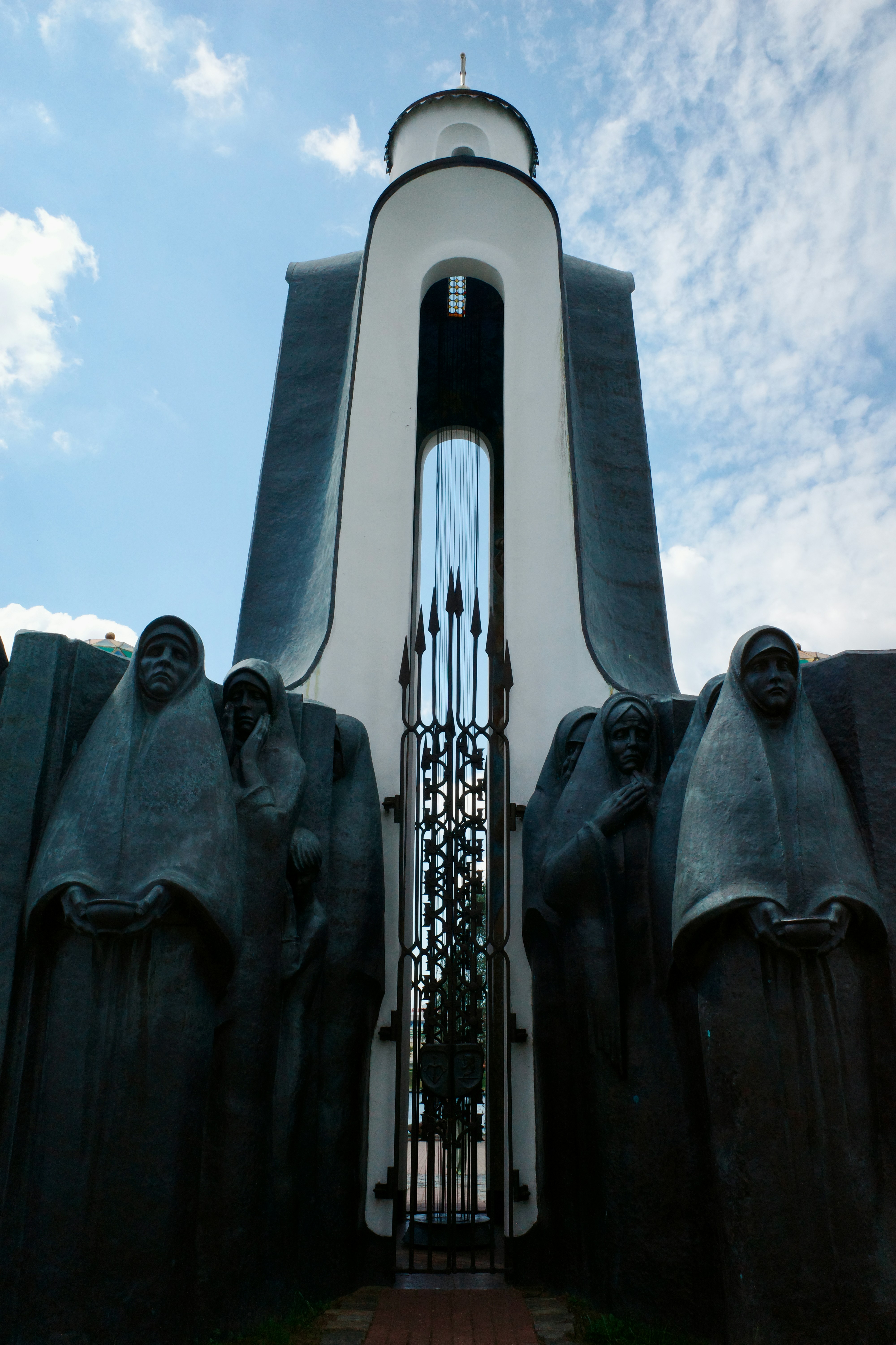 Gateway of Silent Figures: A Monumental Ascent Beneath the Sky