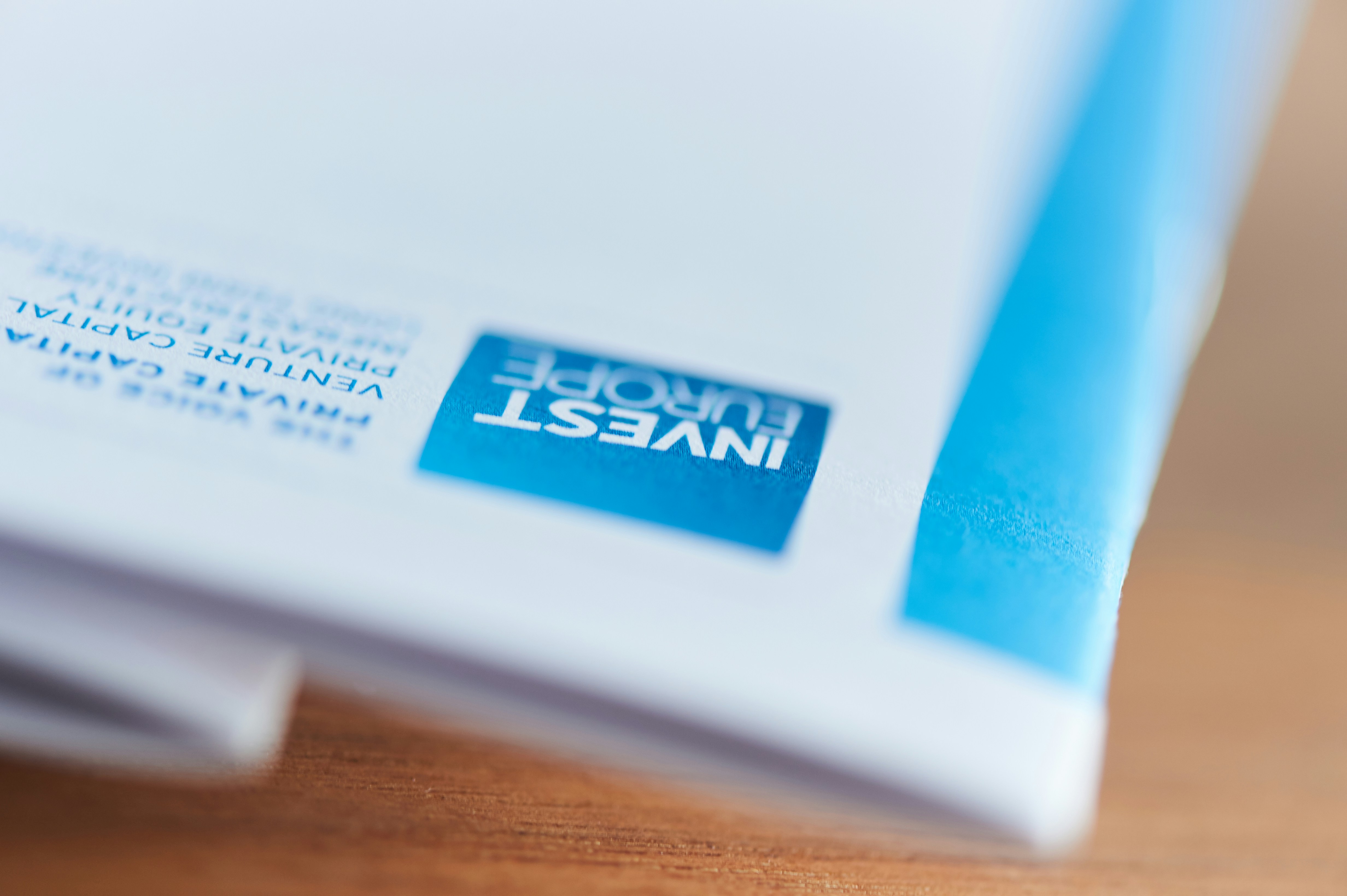 Blue Stamp of Mail: A Close-Up of a Folded Page and a Bright Logo