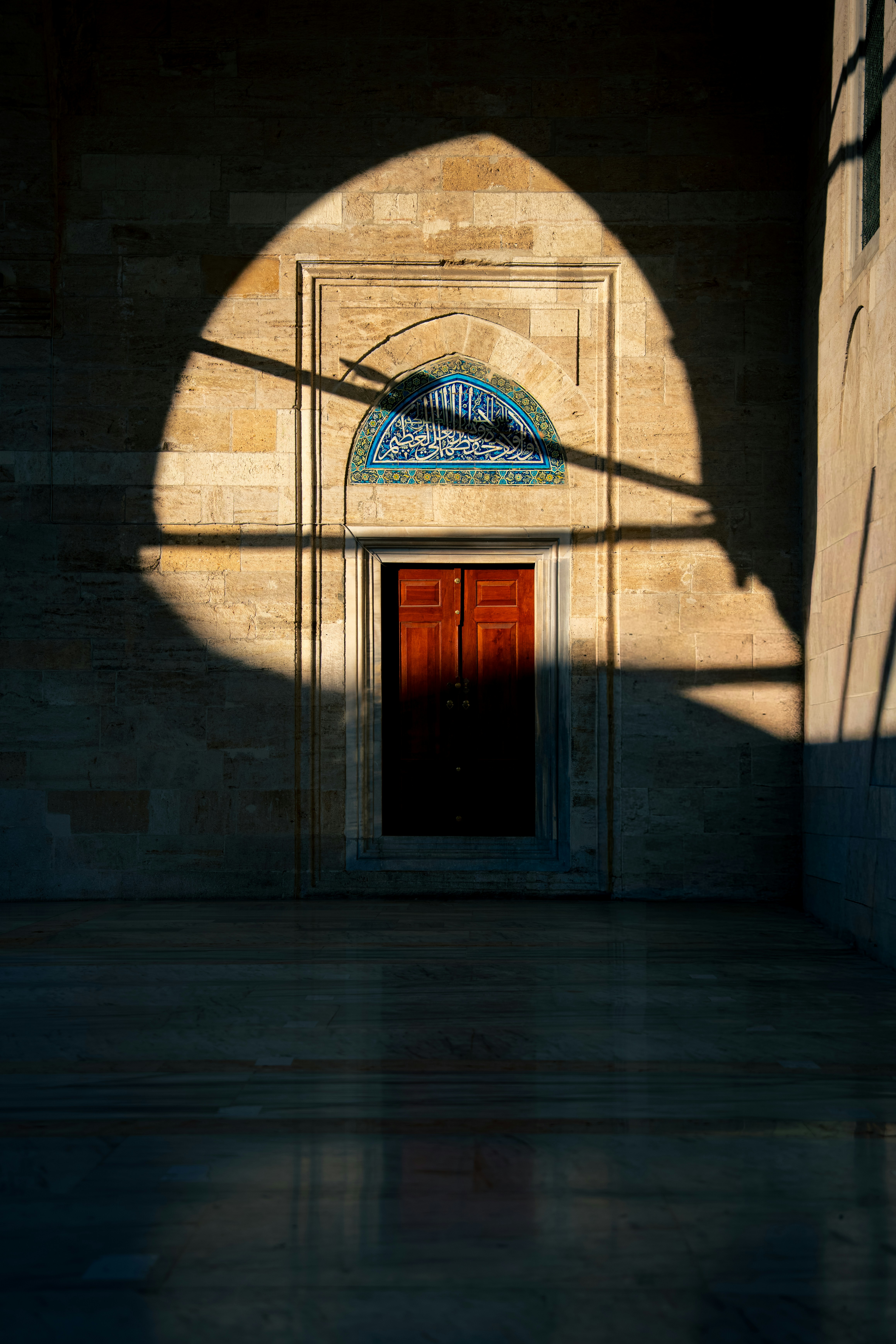Arched Portal in Shadowed Facade