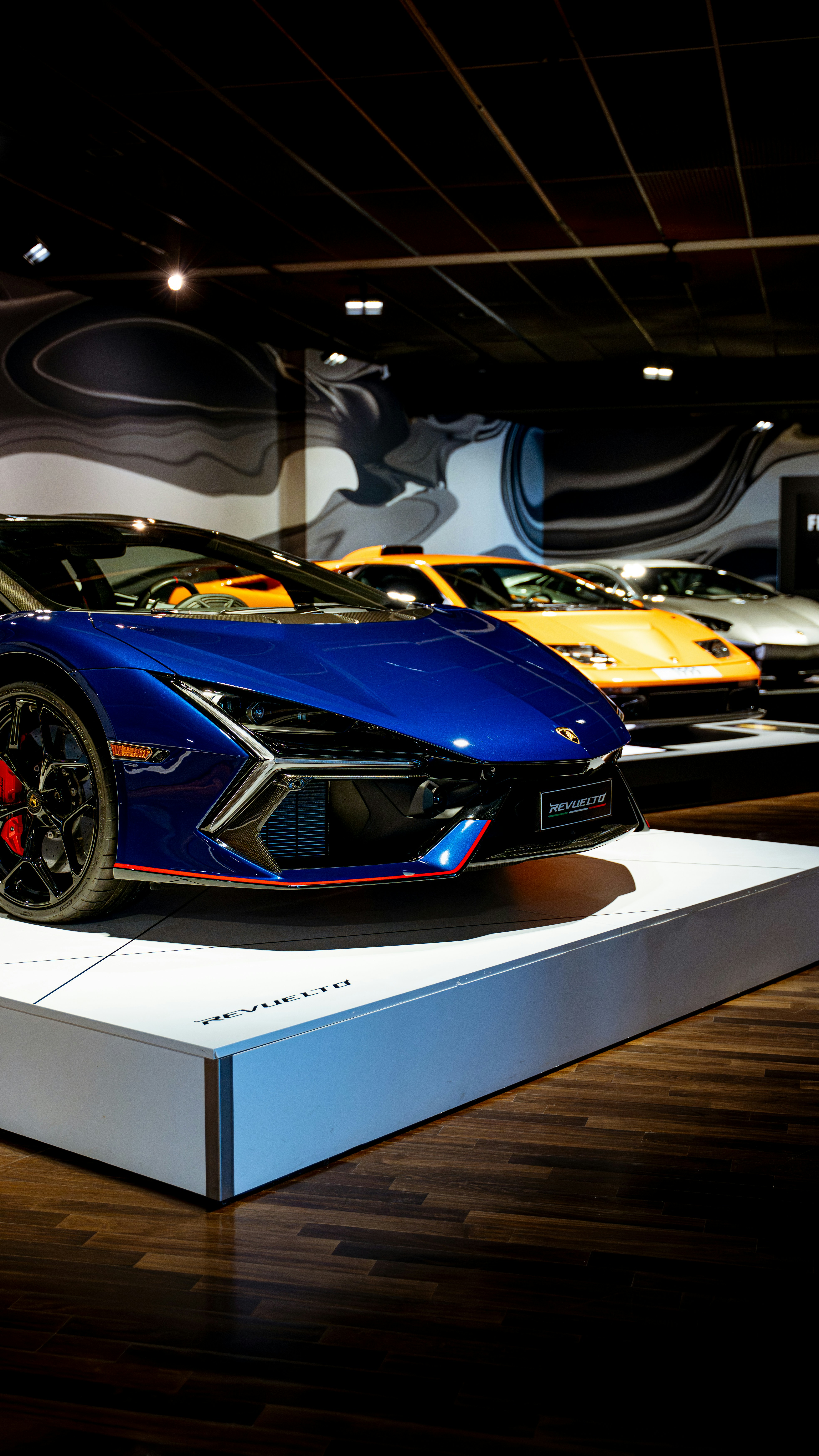 Blue Vortex: A Blue Lamborghini Huracán on Spotlight in a Car Gallery