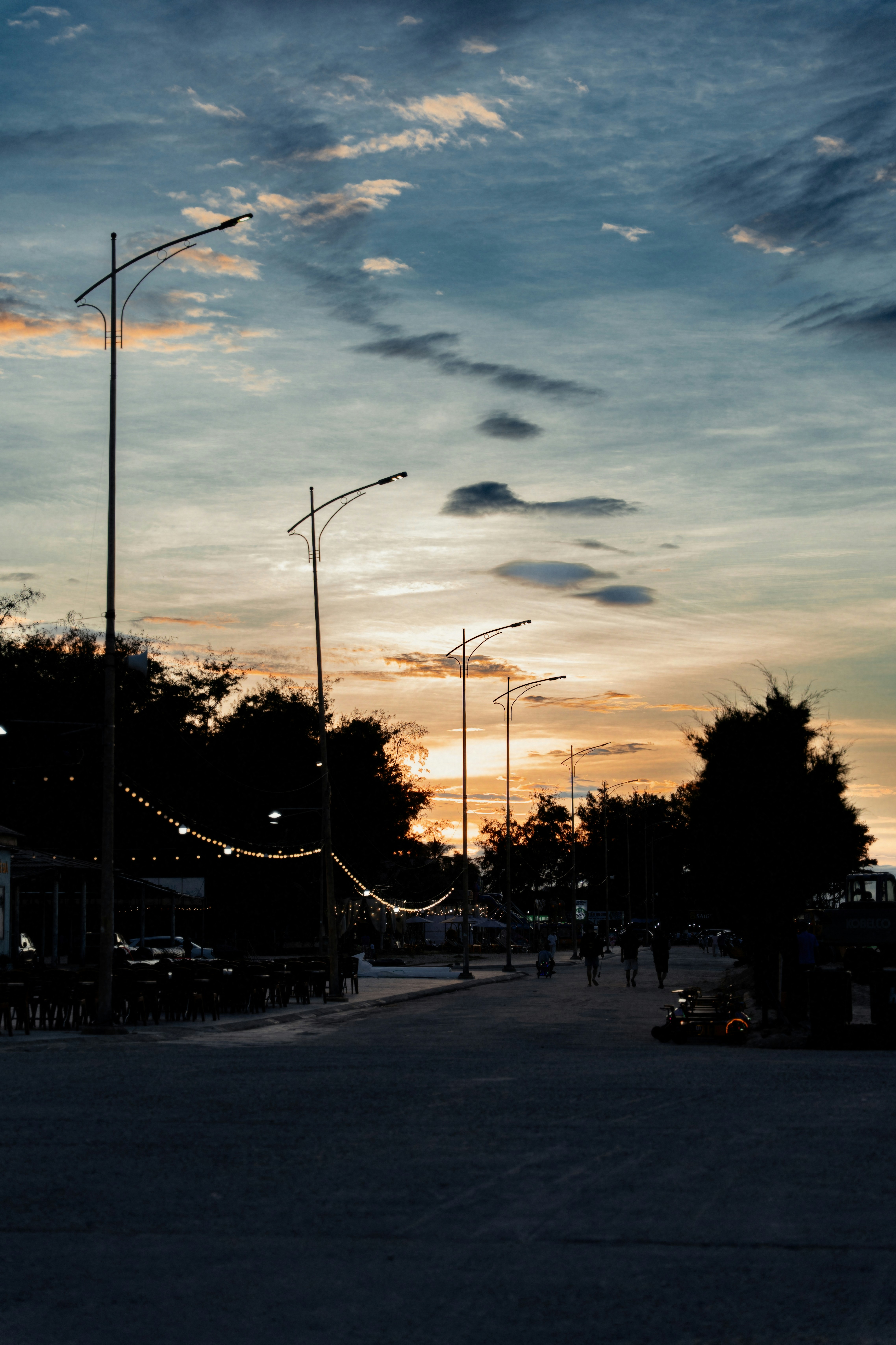 Twilight Strands Along a Lantern-lit Promenade