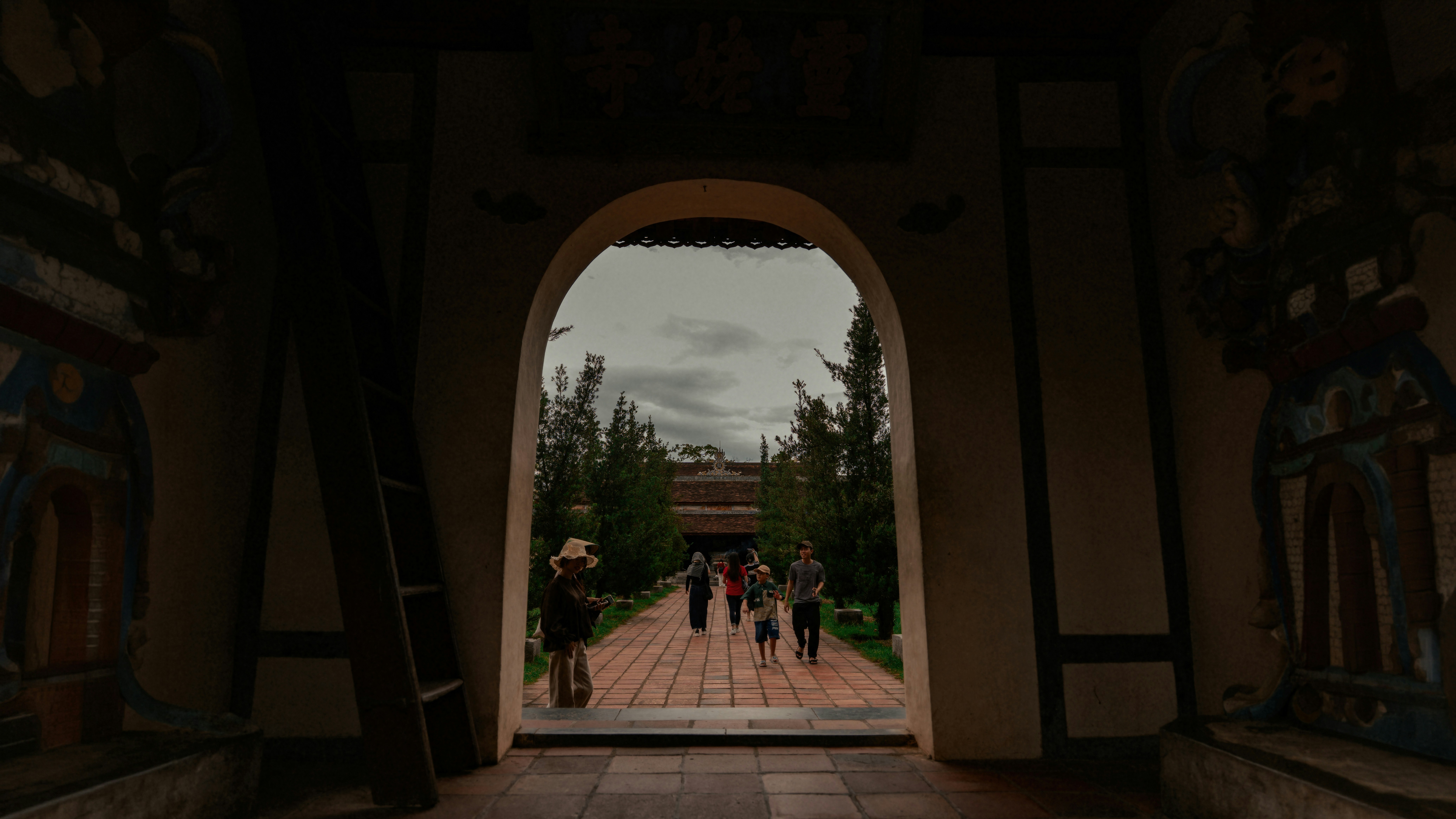 Gate to the Garden: Visitors in the Archway