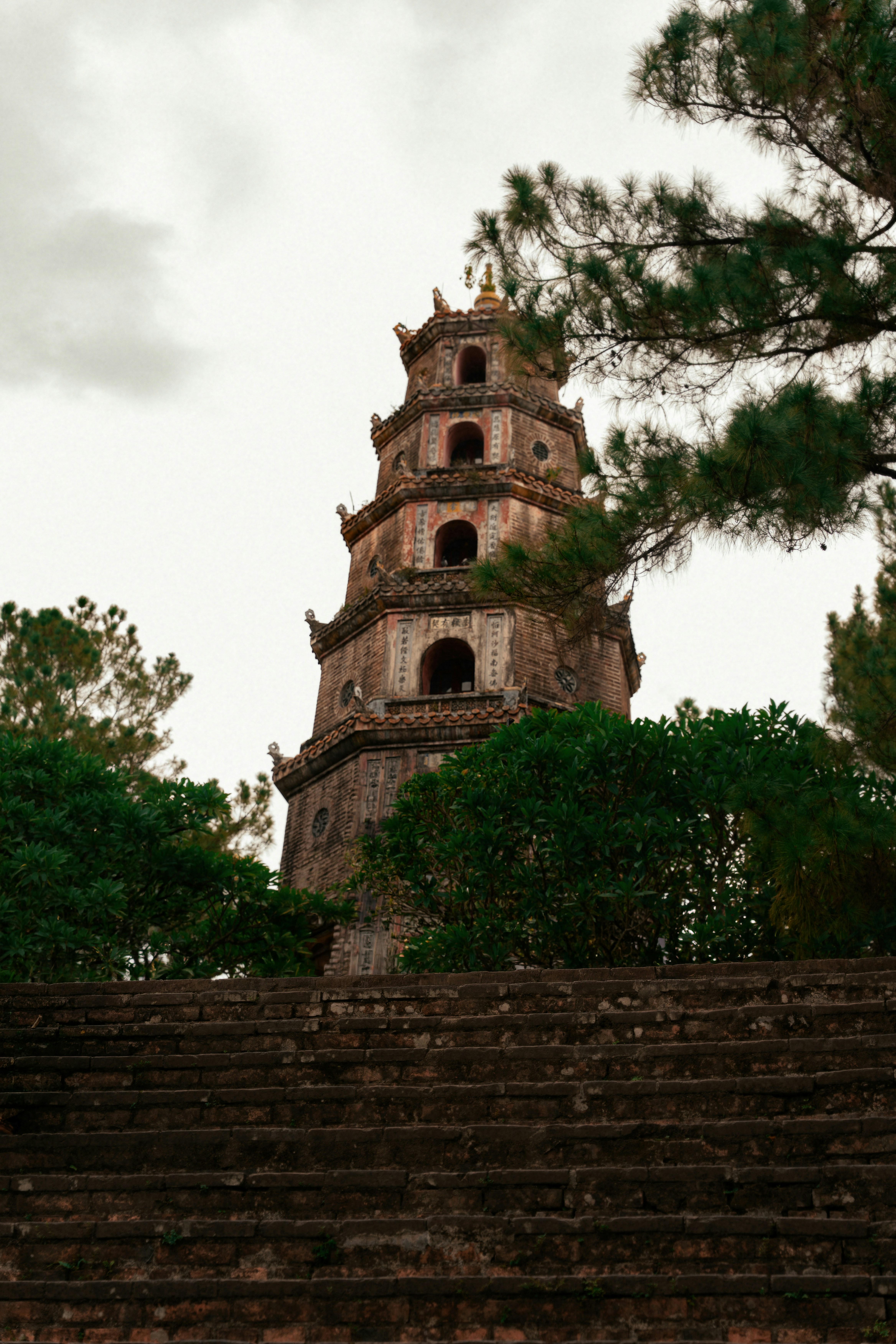 Ancient Pagoda Rising Above Forested Steps