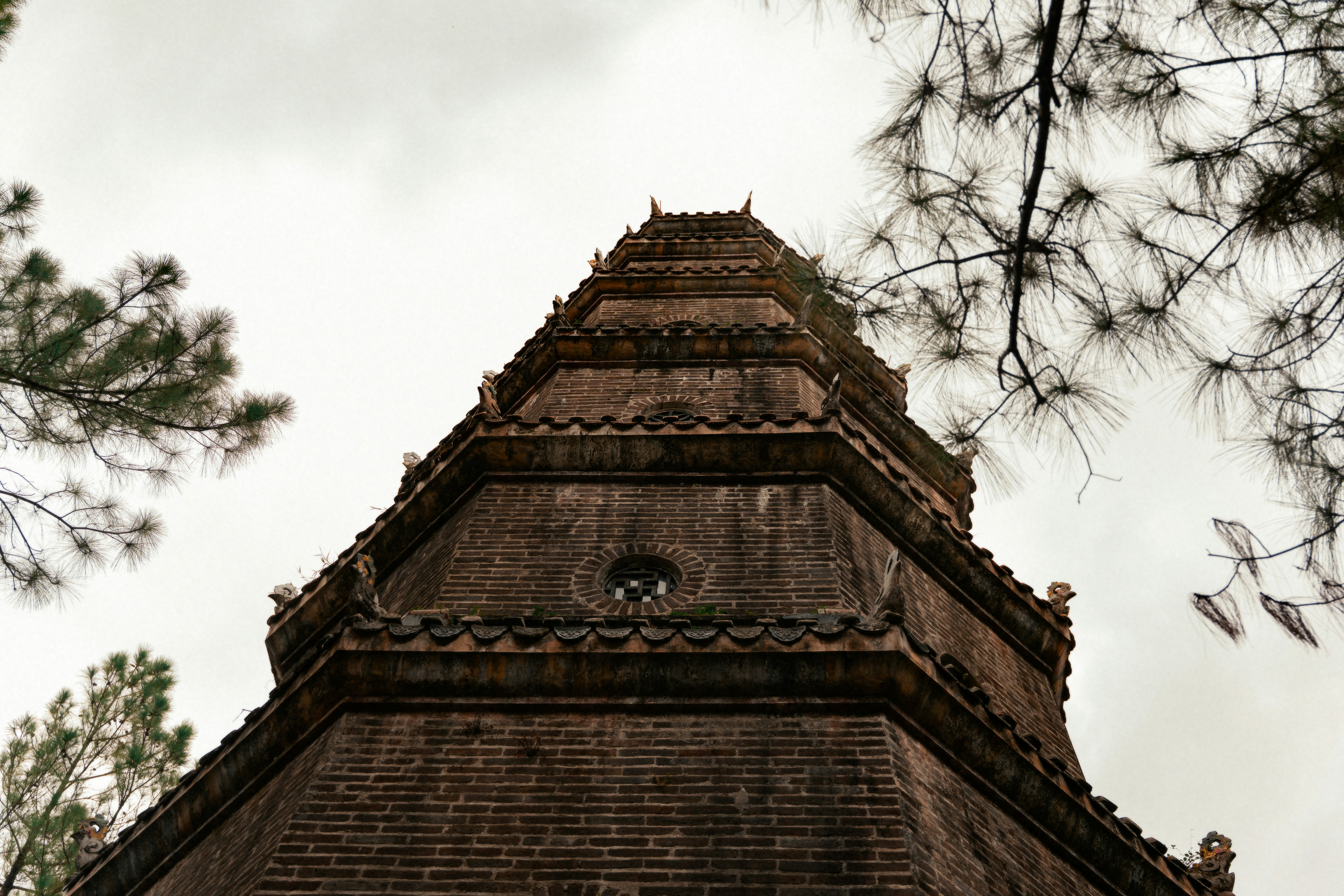 Ascending Brickwork: A Pagoda-Tower Reaches Toward Overcast Skies