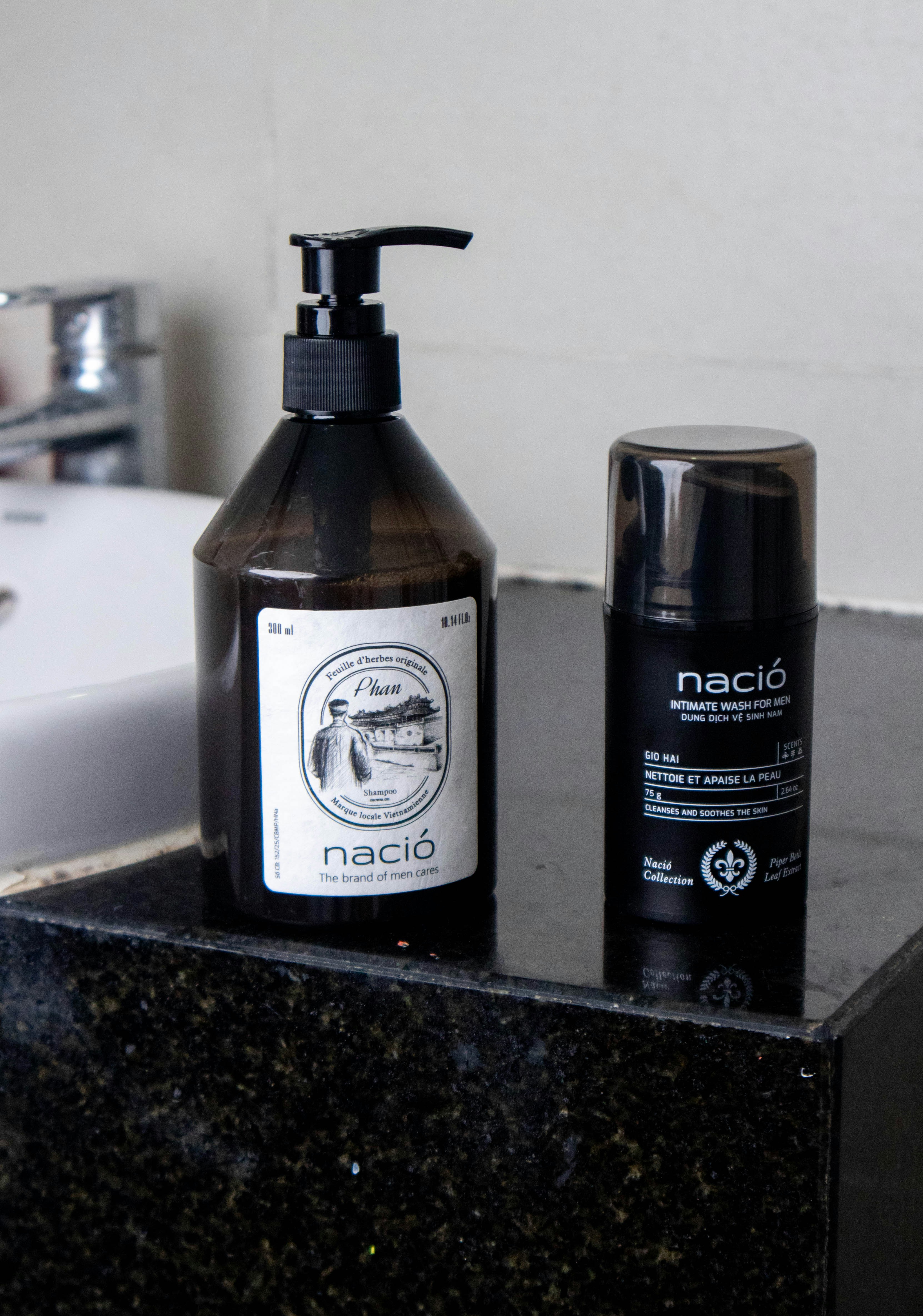 Dual-Carrier of Grooming: A Pair of Nació Bottles Anchored on a Marble Counter