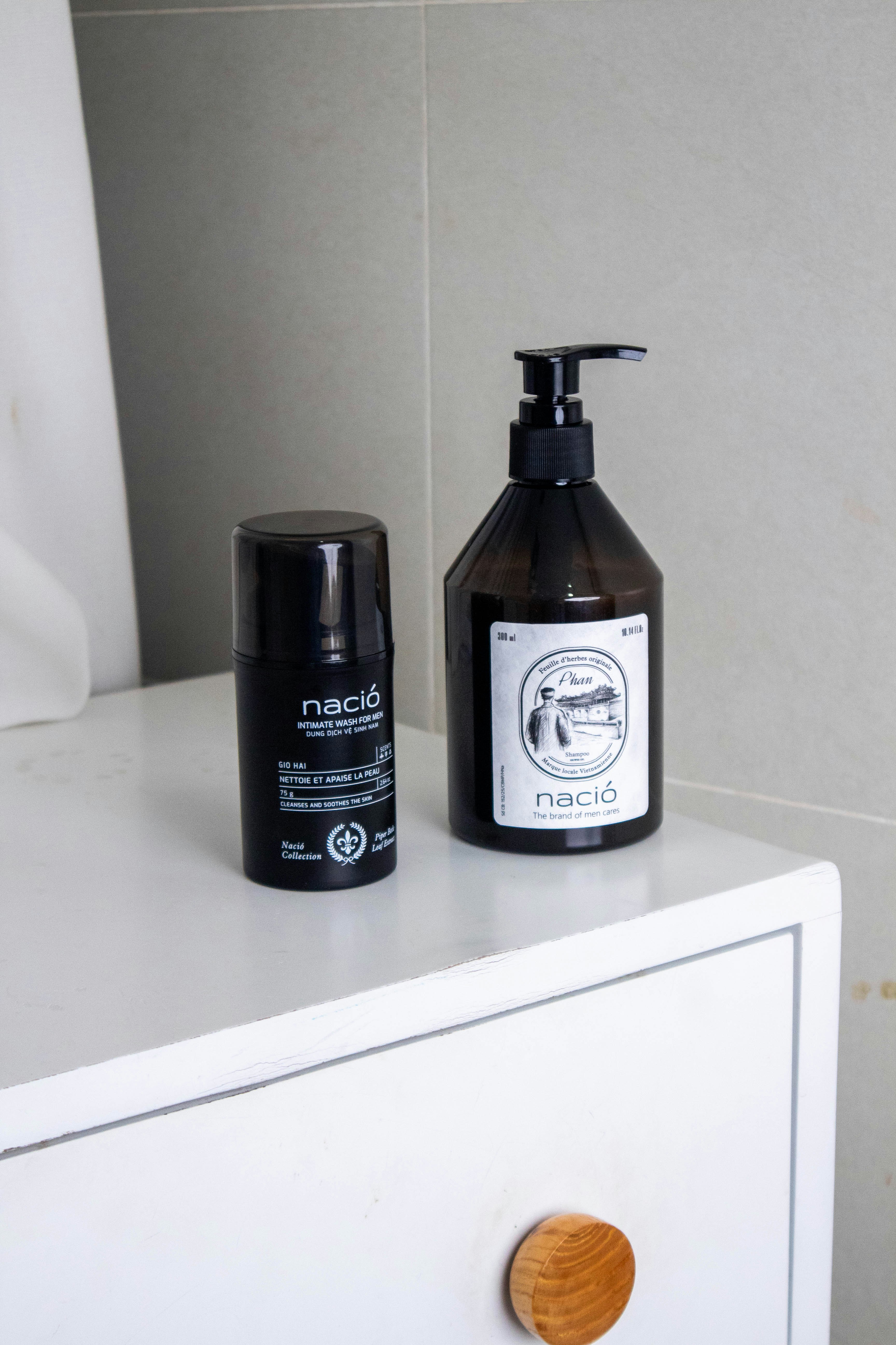 Two Bottles on a White Cabinet: Minimalist Bathroom Still Life