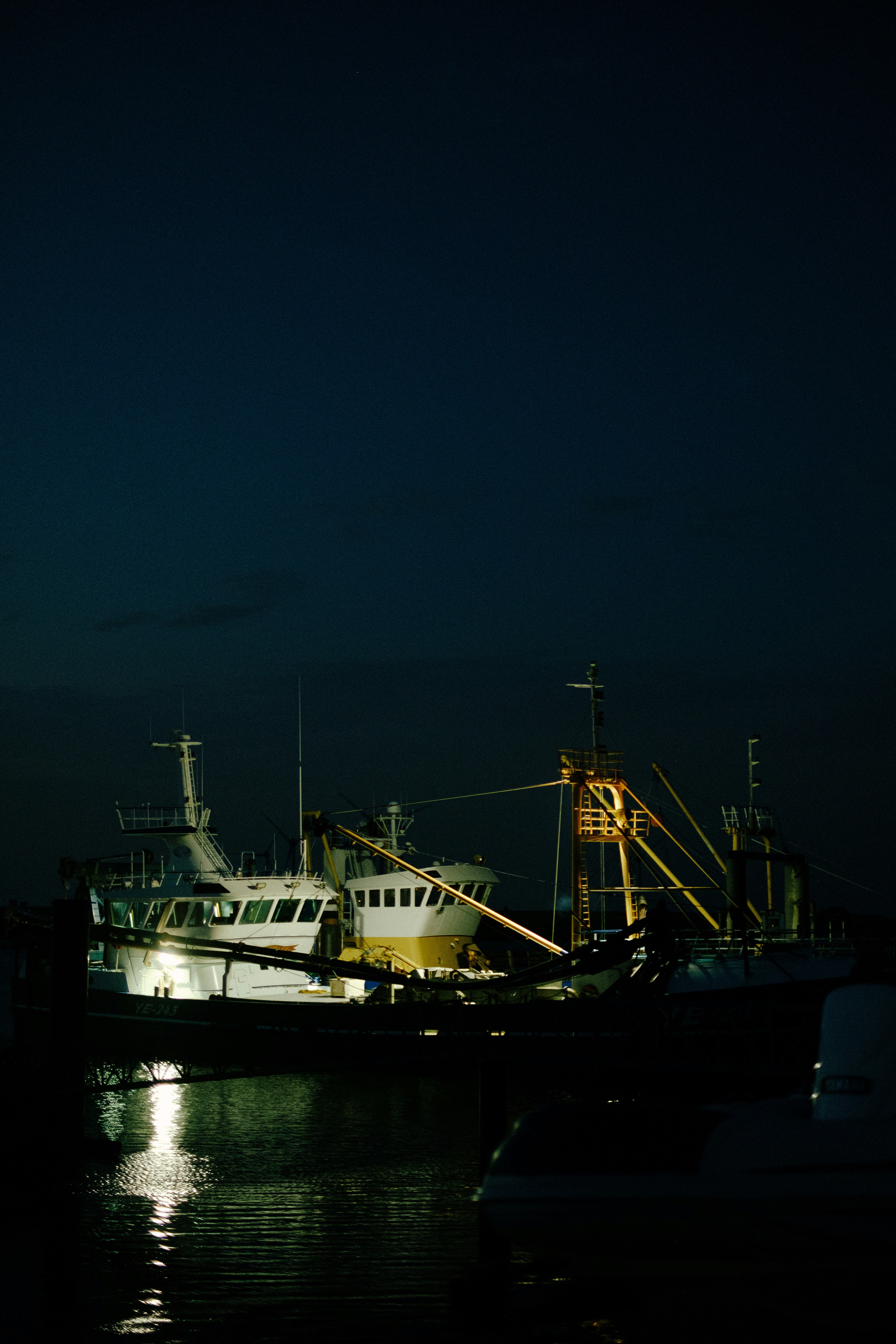 Night Harbor Convergence: Quiet Boats Under Moonlit Sky