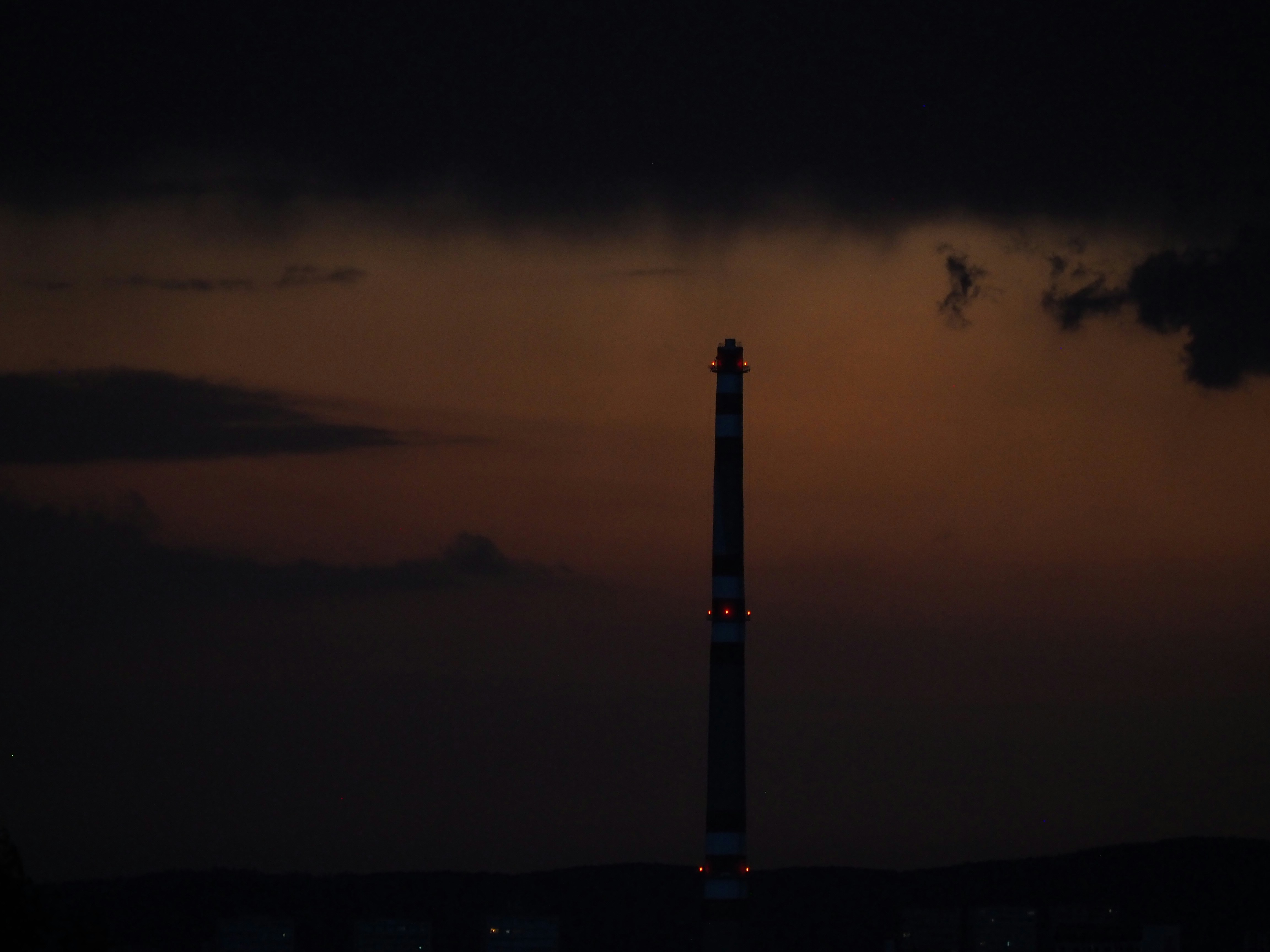Lighthouse at Dusk: A Quiet Silhouette Against a Fading Horizon