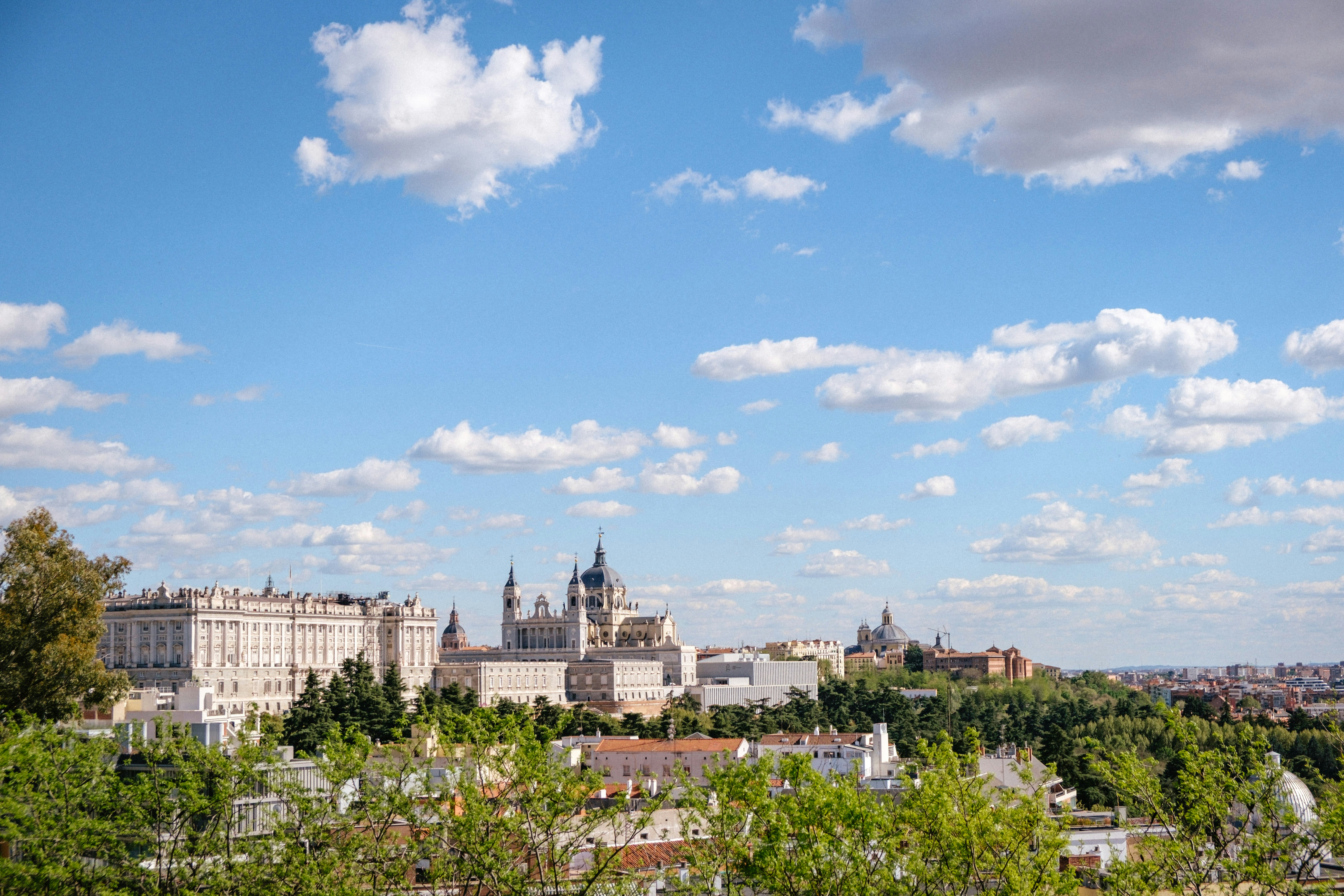 Cityscape Vista: Historic Skyline Under a Pierced Blue