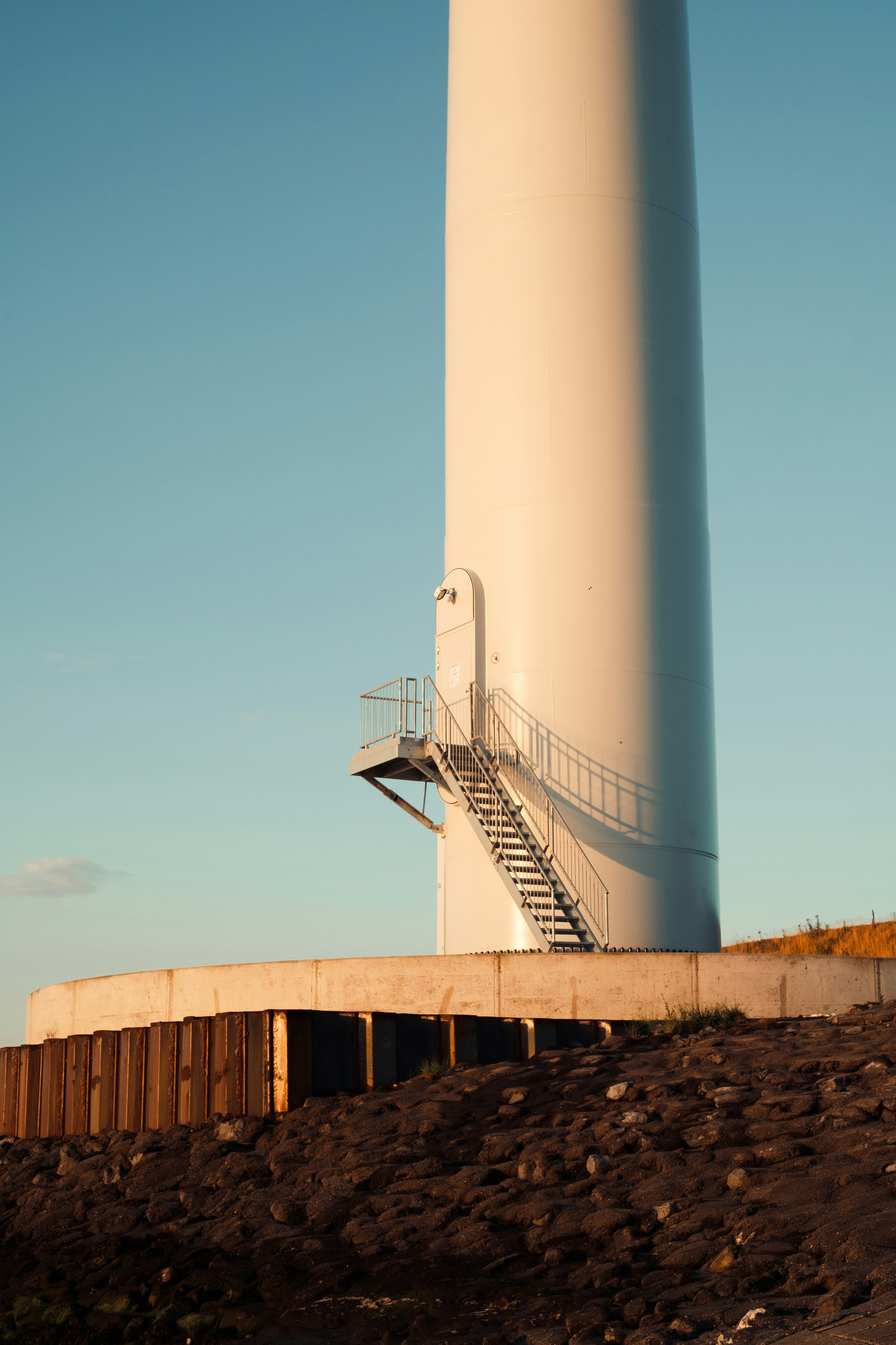 Tall Sentinel: A Wind Turbine Watchtower at Dusk