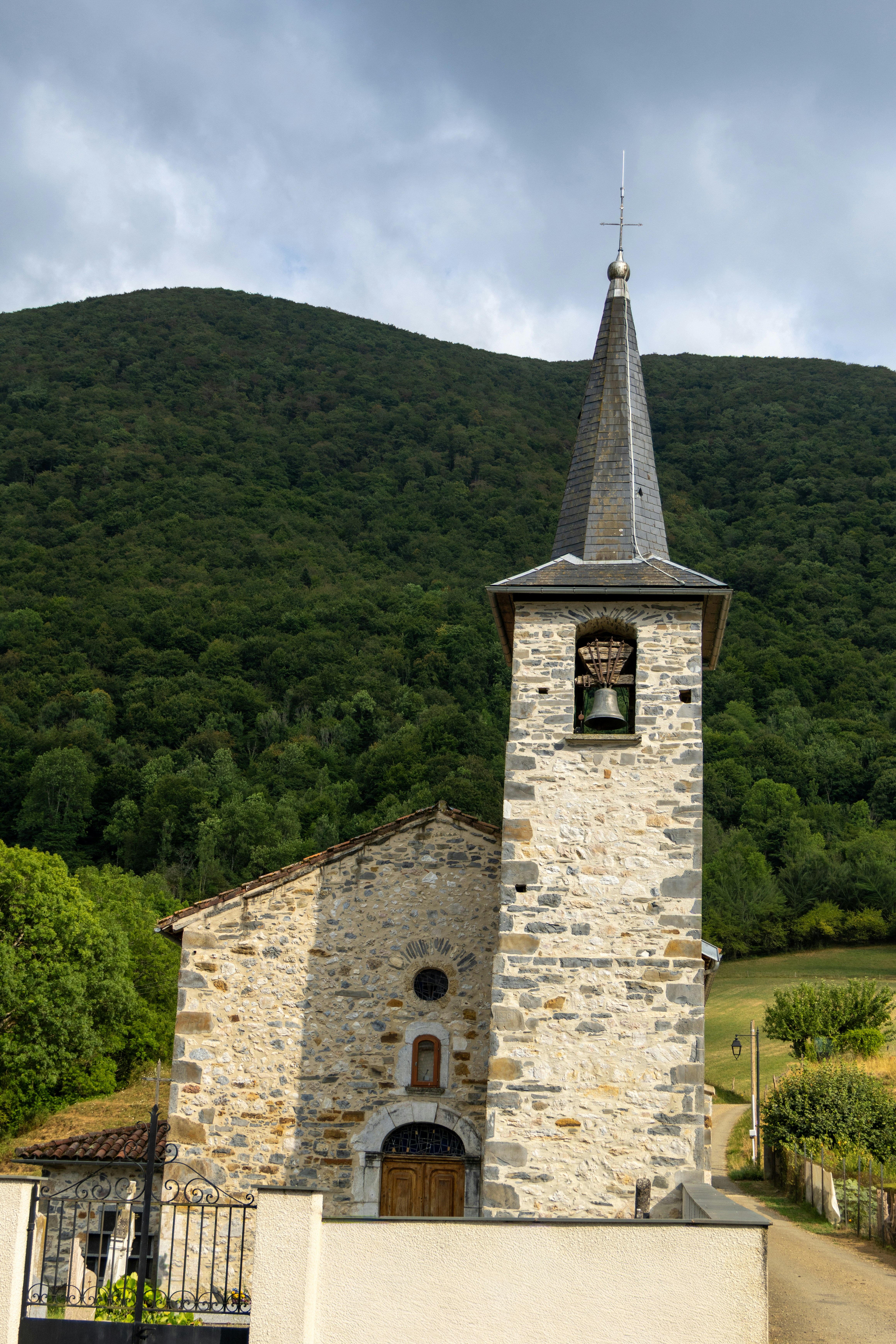 Stone Chapel Rising Above the Green Slopes