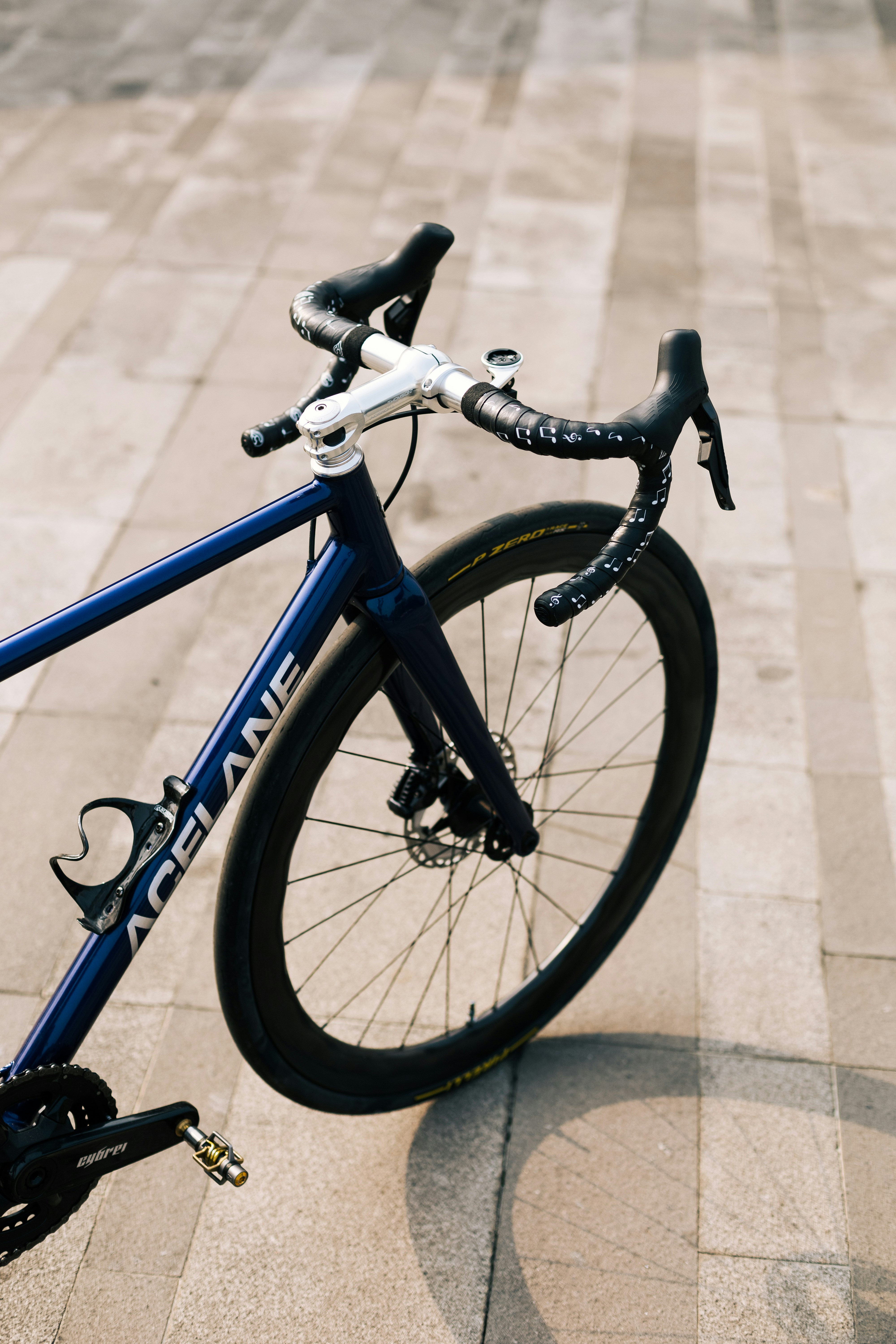 Blue Veil: A Road Bicycle Standing Tall on Quiet Pavers