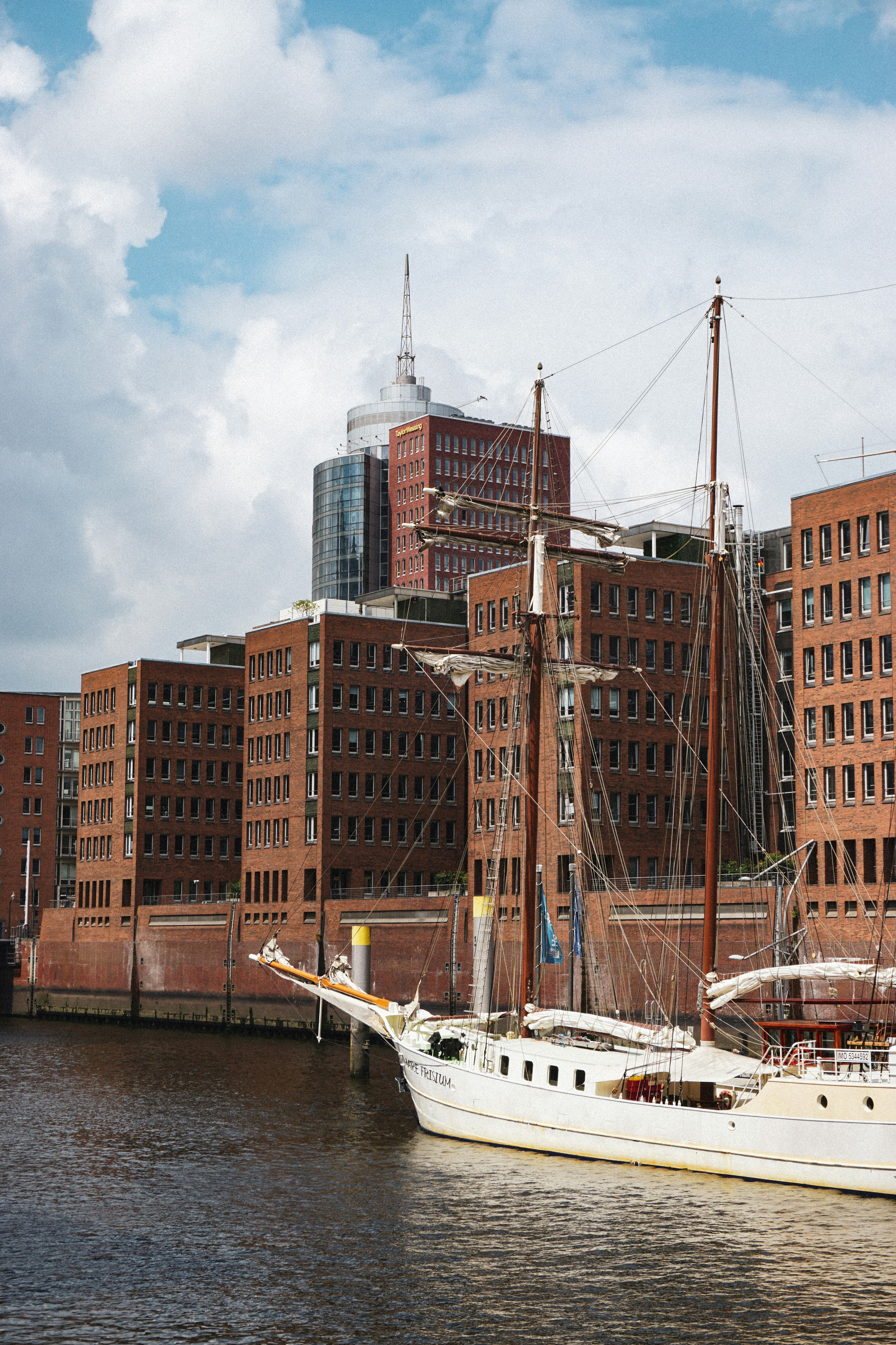 Harbor Sloop and Brick Skyline