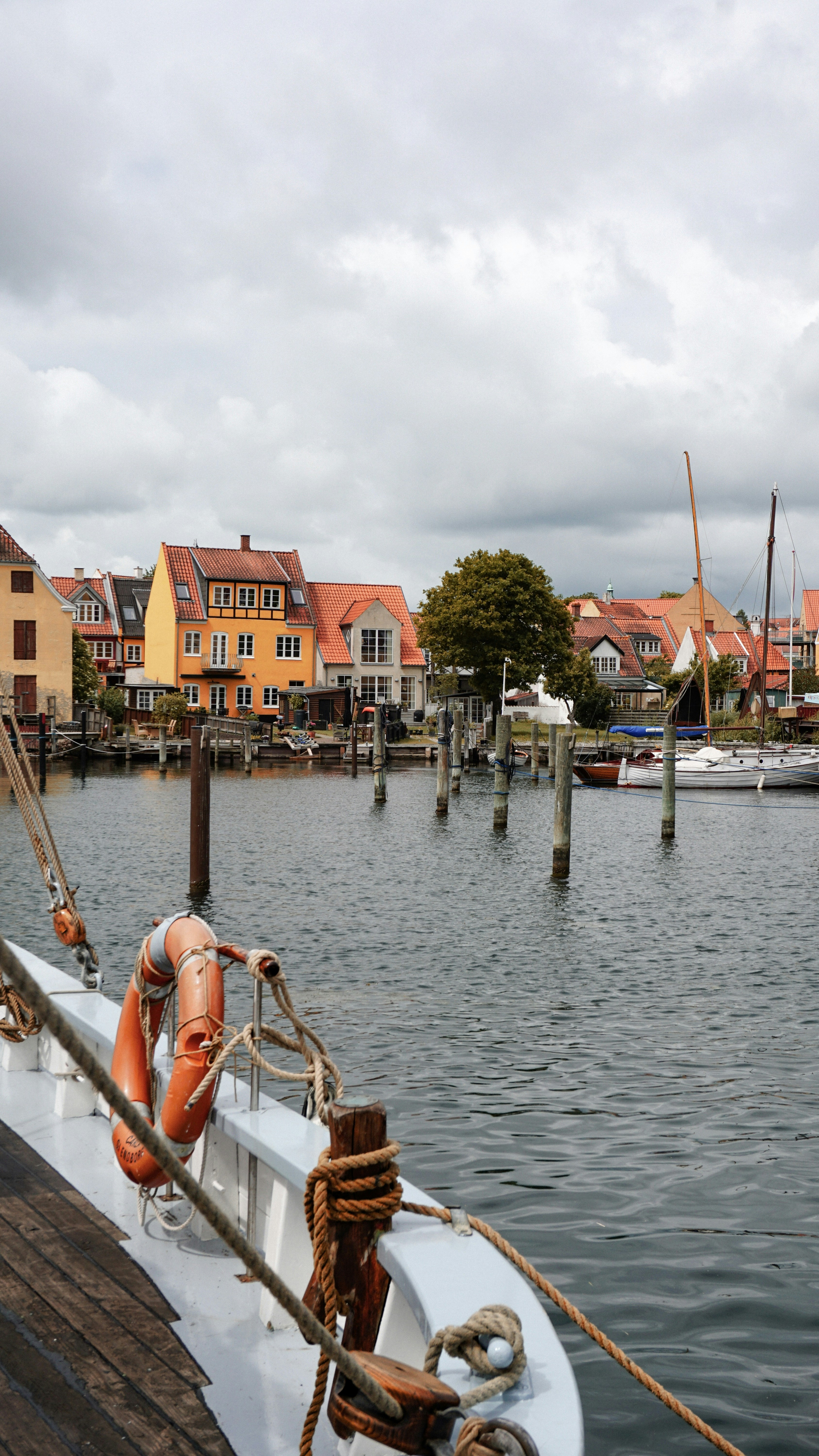 Colorful harbor village from the deck, with moored boats and vivid houses