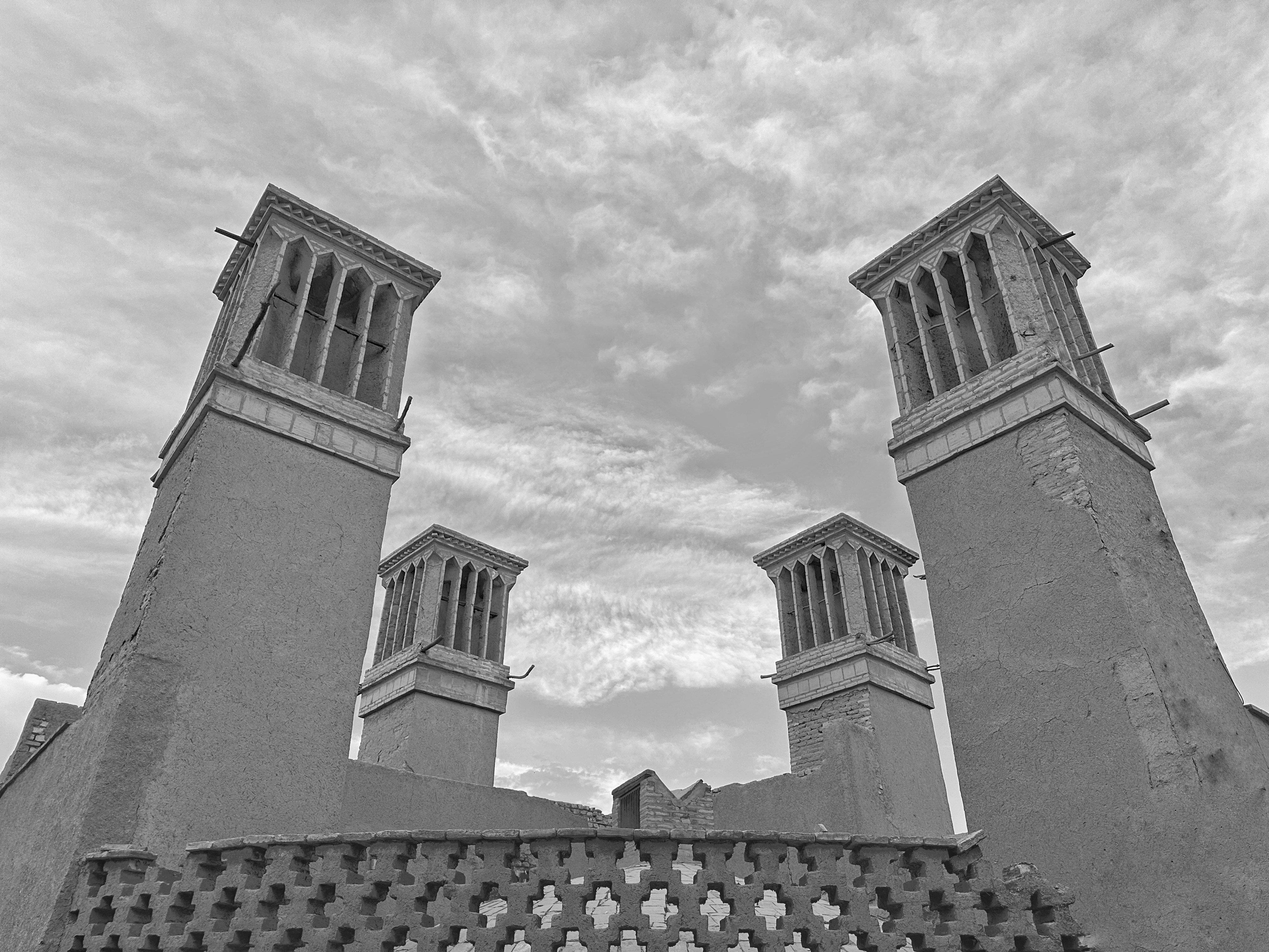 Chimneys in monochrome: a rooftop symphony against a cloudy sky