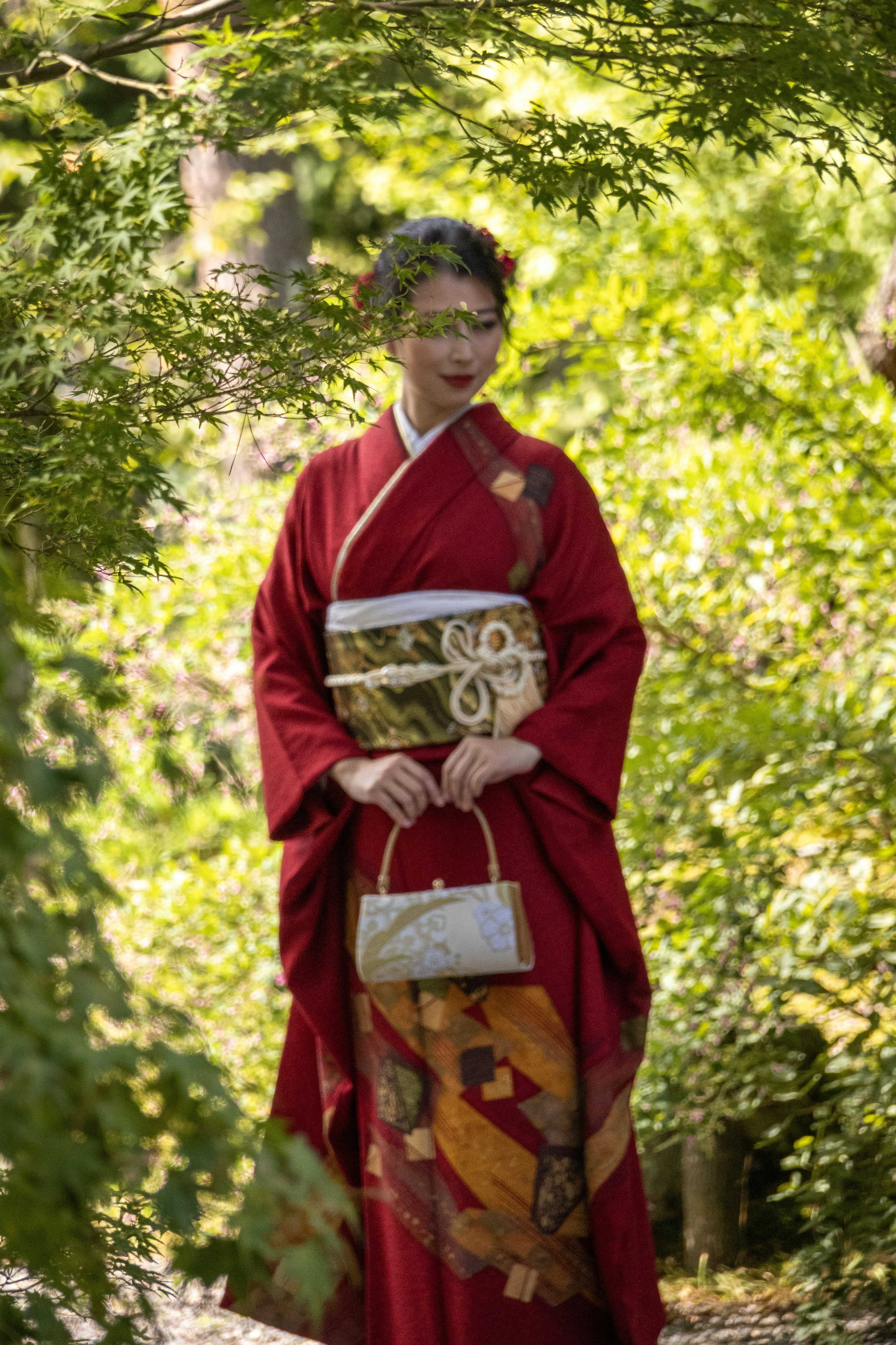 Crimson Kimono in a Sunlit Japanese Garden