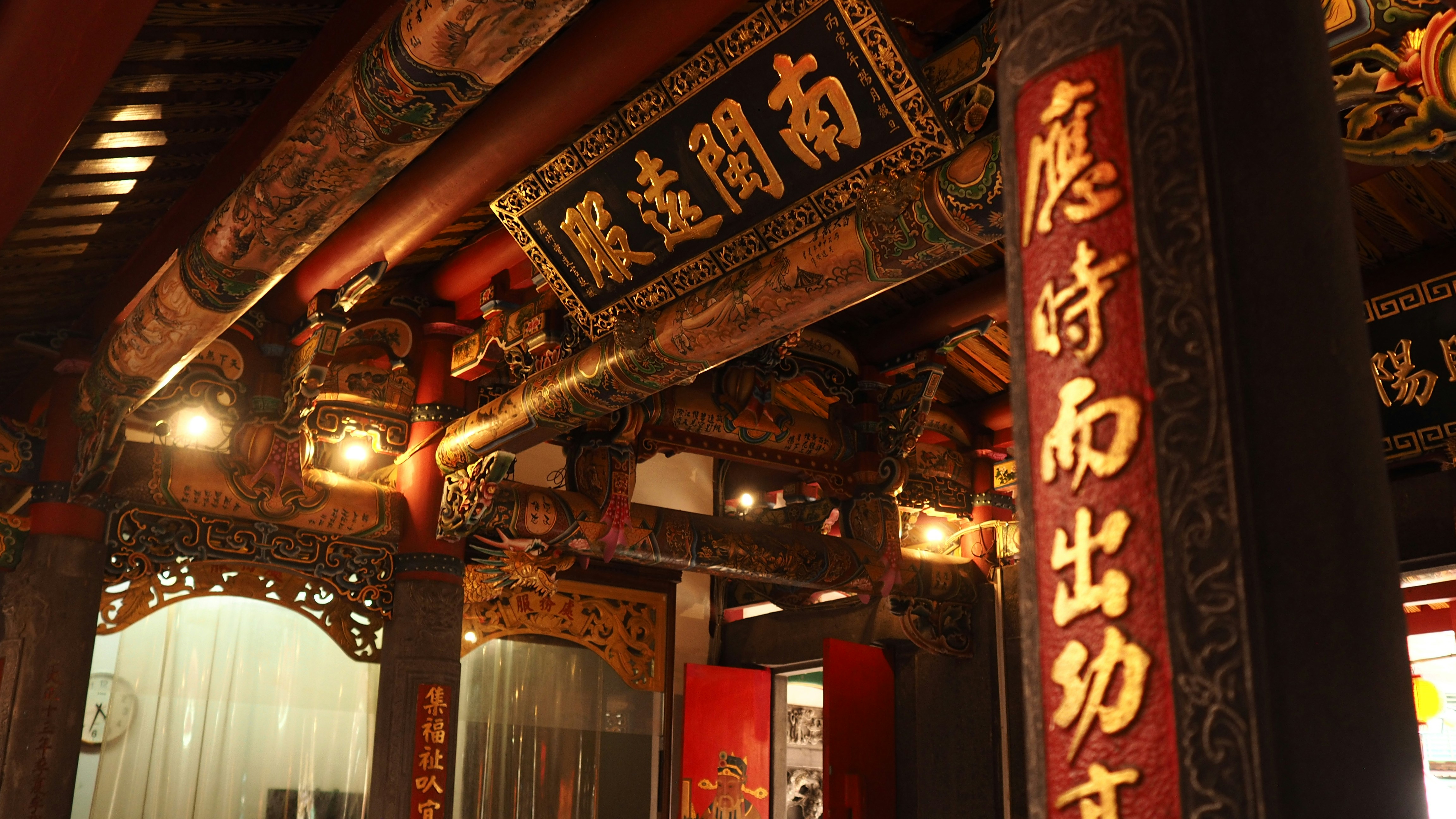 Ornate Lanterns and Carved Beams of a Sacred Corridor
