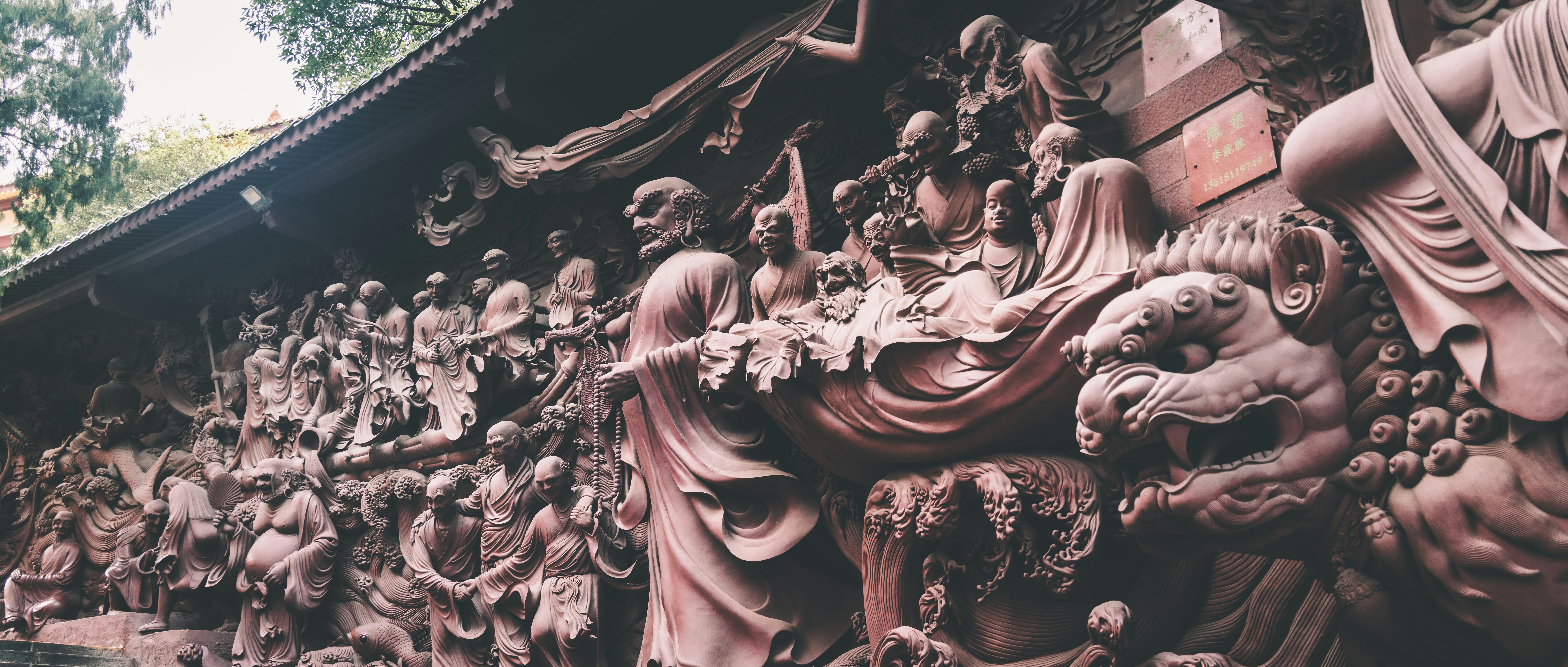 Echoes in Stone: A Prayerful Frieze of Robed Figures