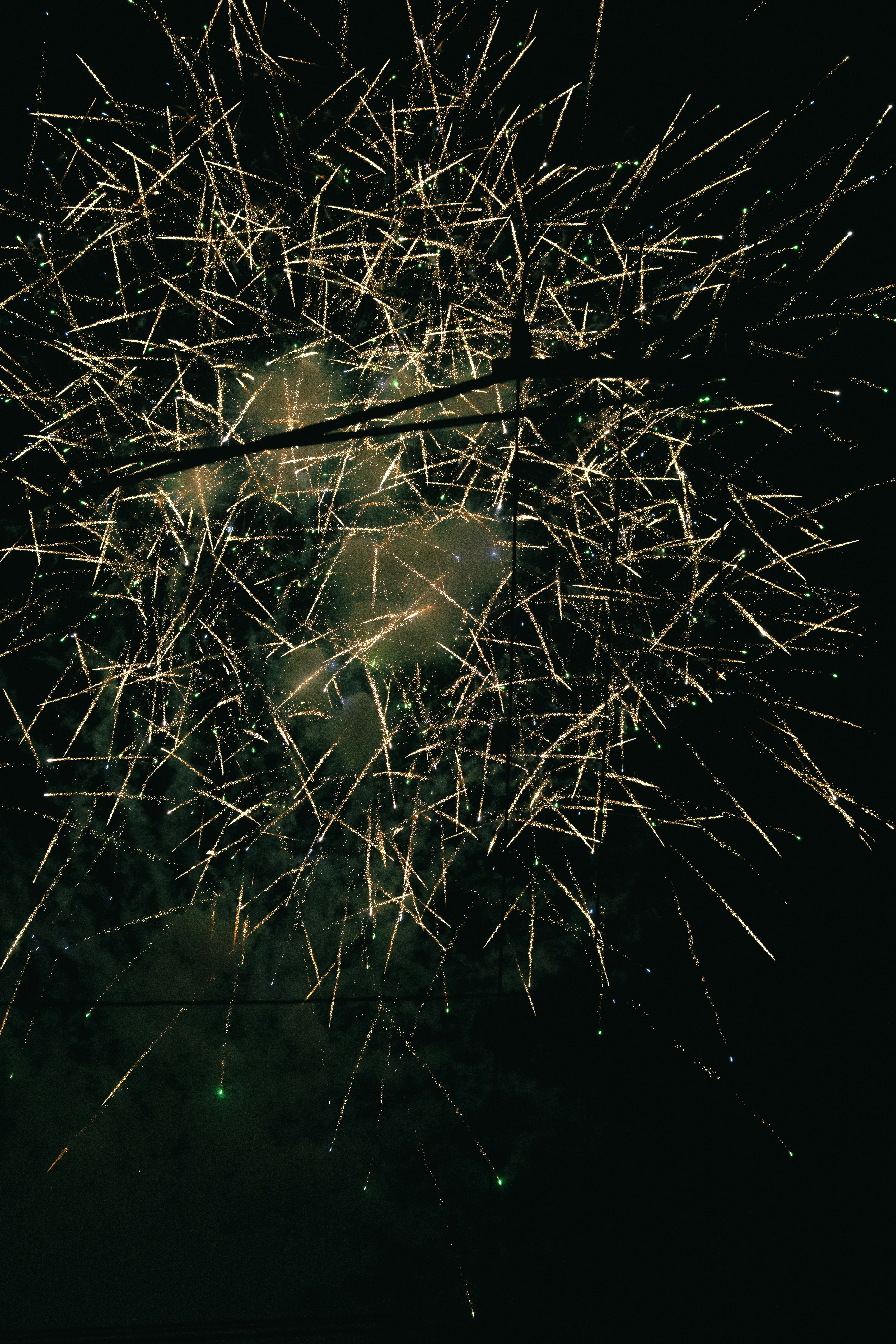Central Burst: A Night Sky Framed by Golden Streaks