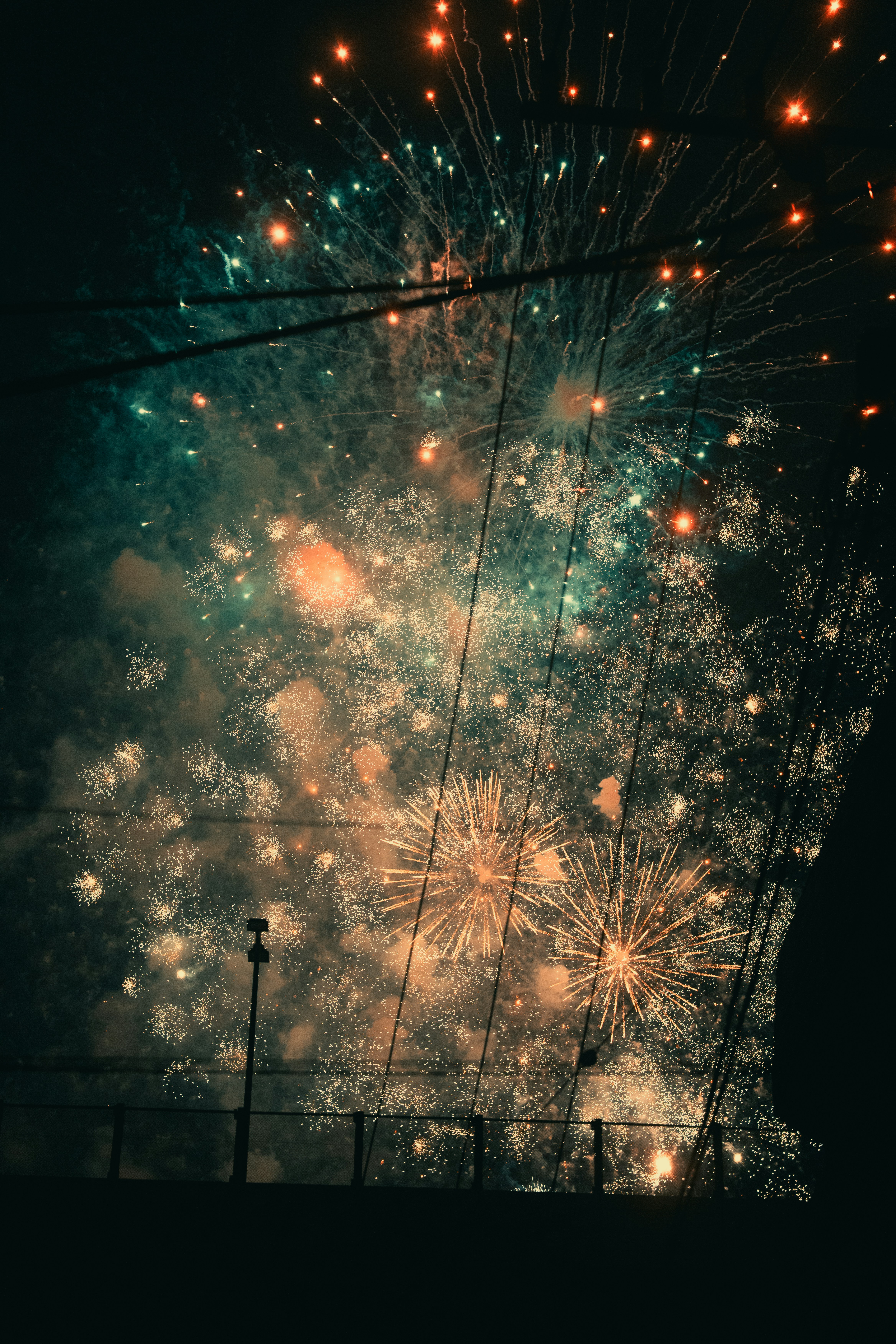 Night Burst: Fireworks Illuminating the Dark Skyline
