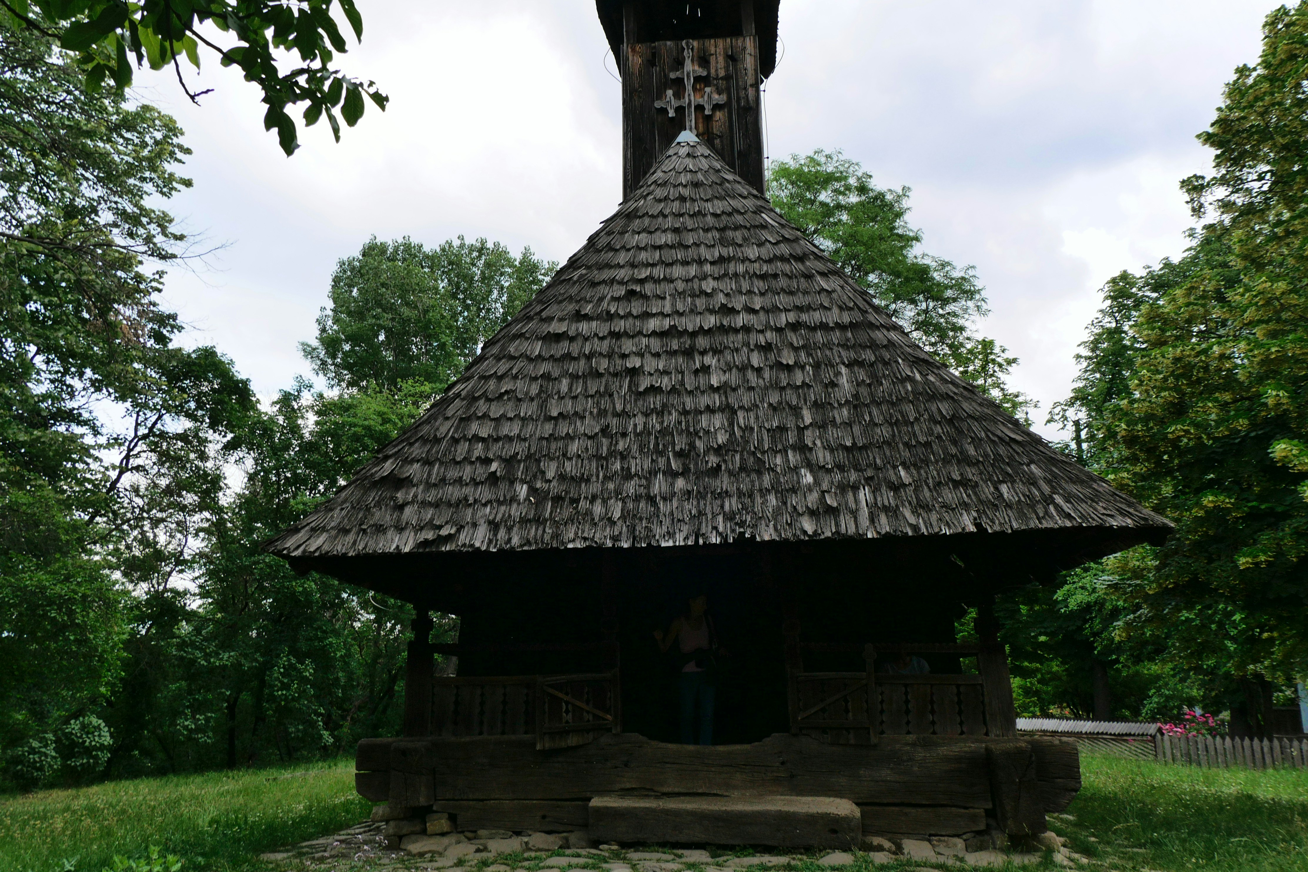 Wooden chapel in a sunlit clearing