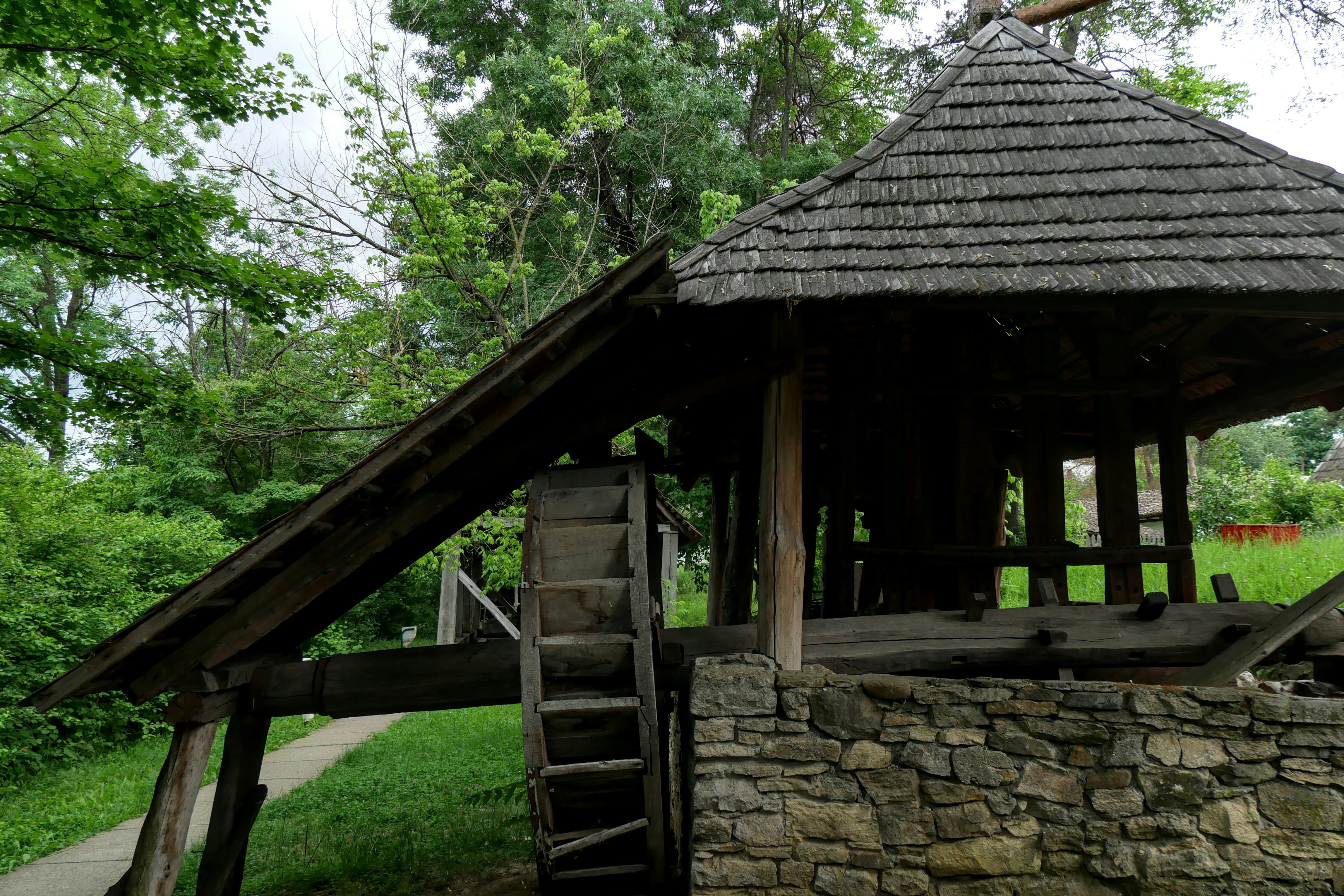 Waterwheel Gazebo Overlook in a Lush Green Clearing