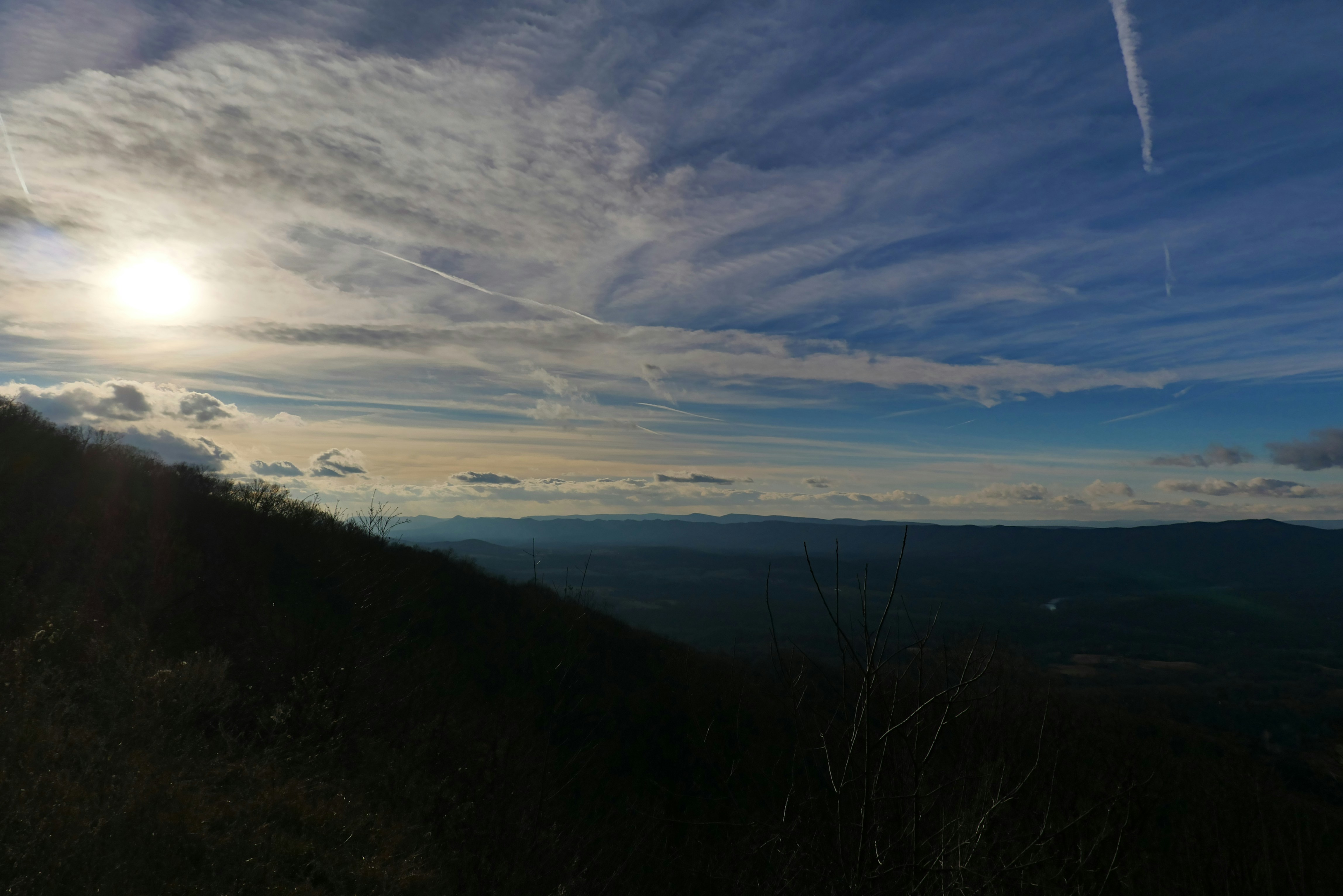 Dawn Over the Ridge: Sunlit Sky Over Quiet Hills