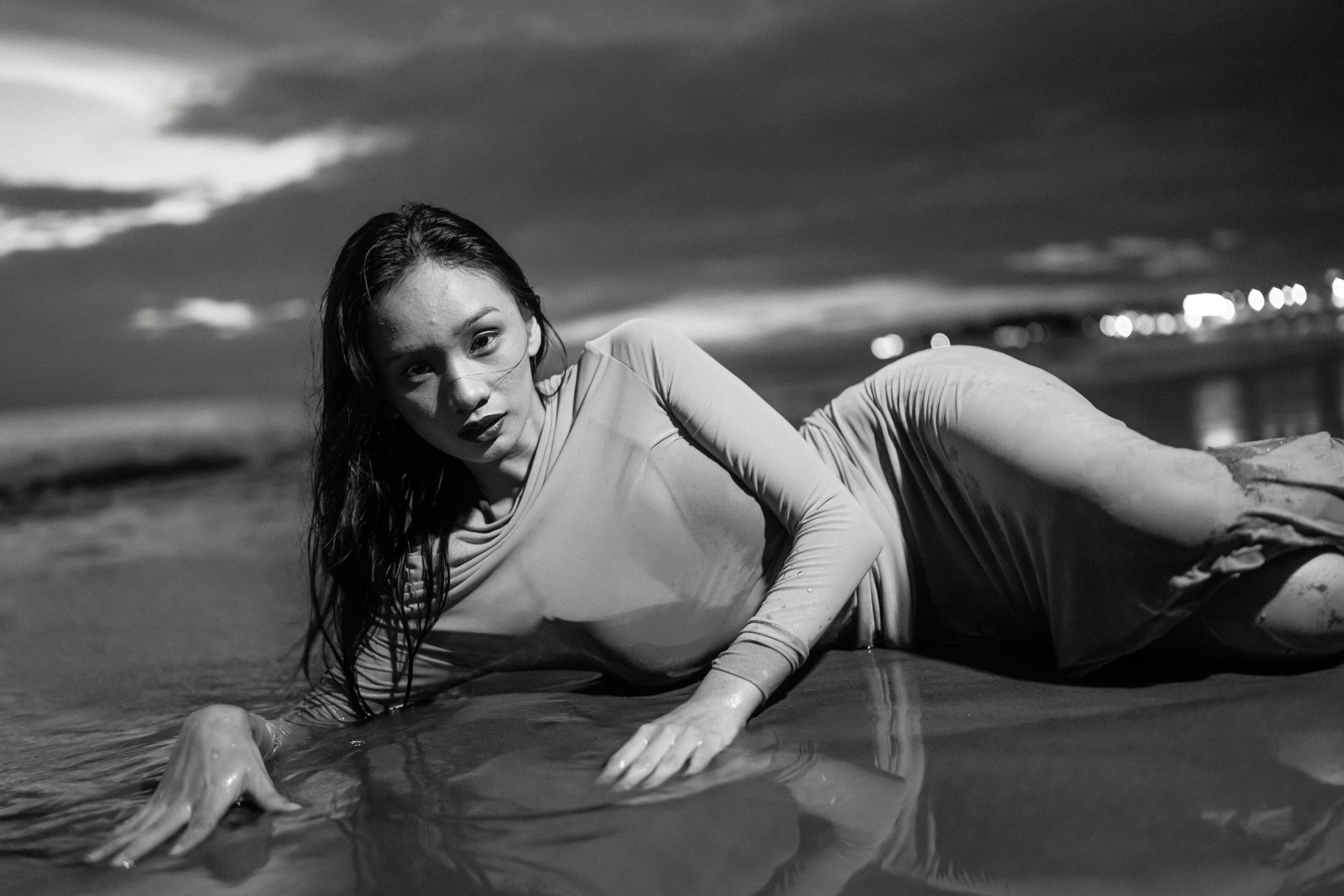 Low Tide, Quiet Gaze: A Lying Portrait on Wet Sand