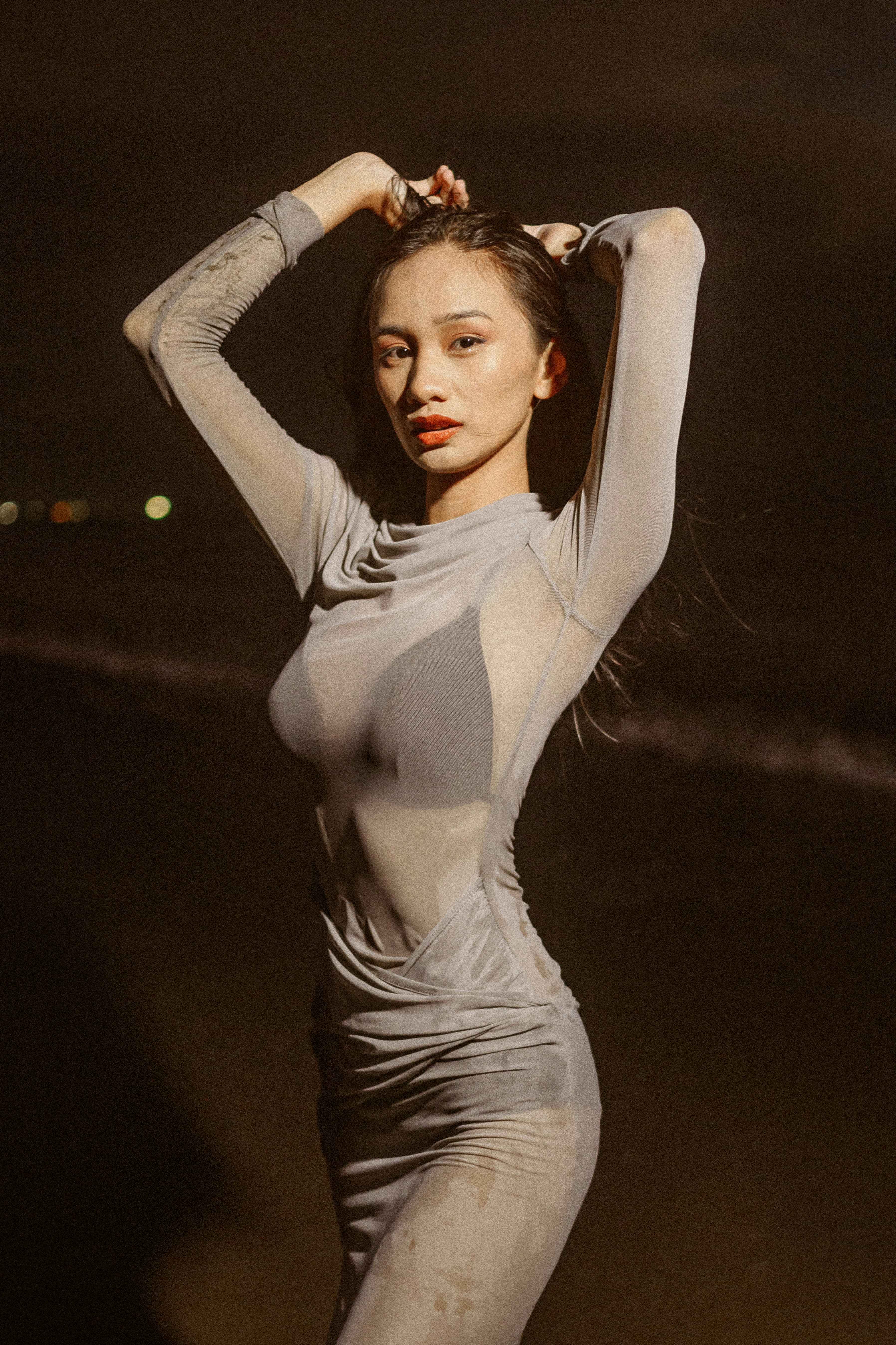 Moonlit Pose: A Silhouette against the Night Shore