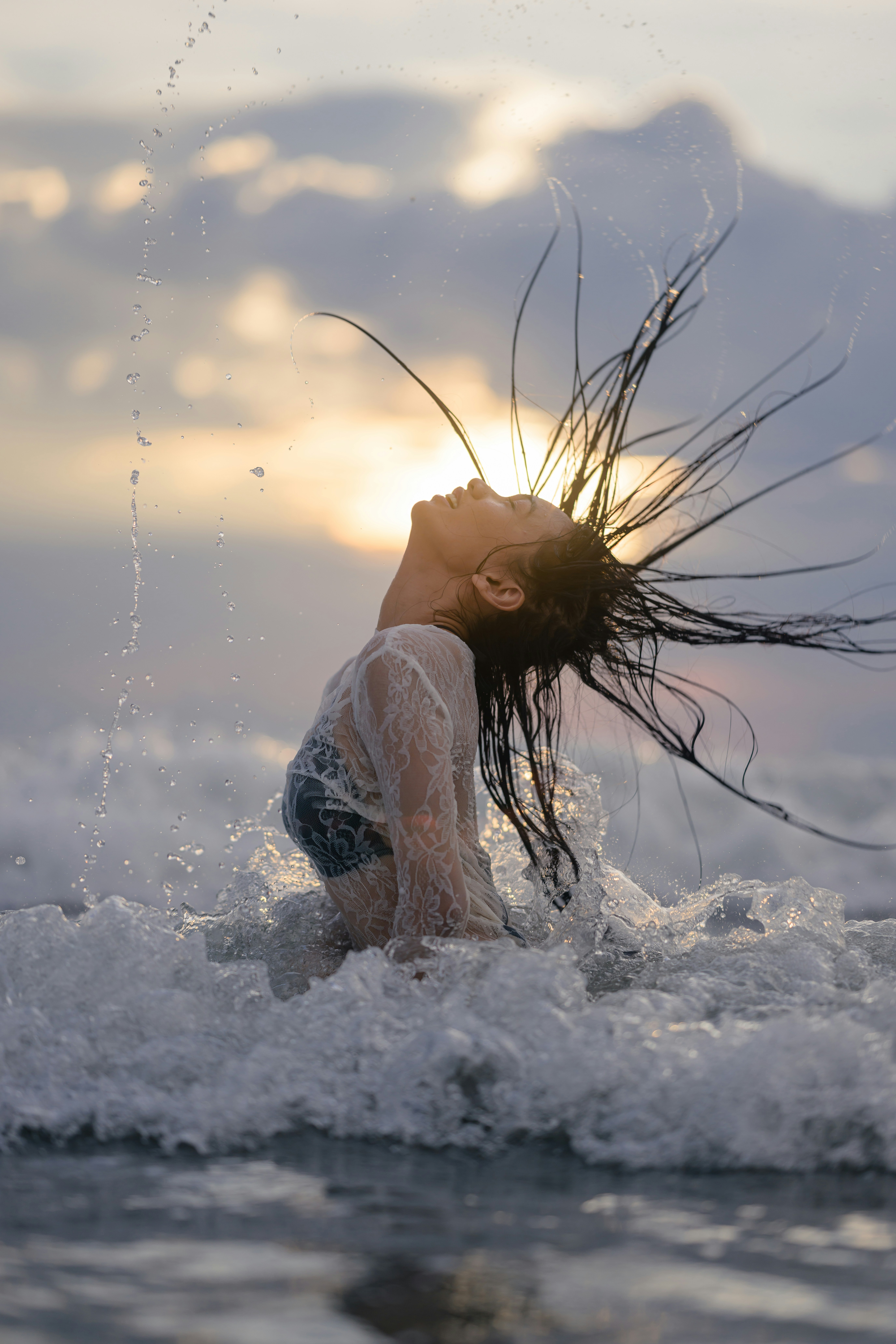 Sunlit Reverie: A Wave of Hair in Ocean Spray
