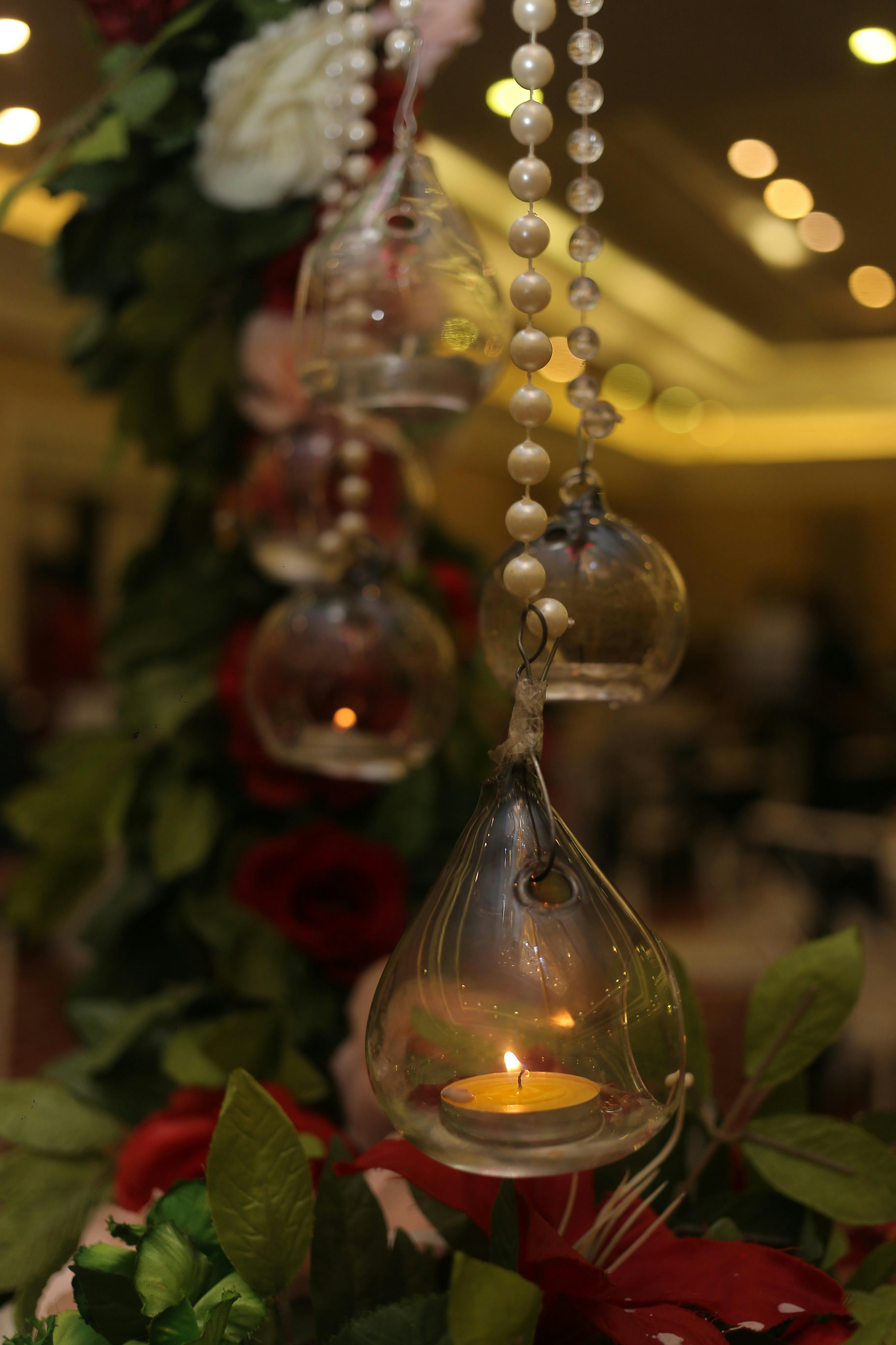 Glass-ornamented Candles Amid Floral Drapery