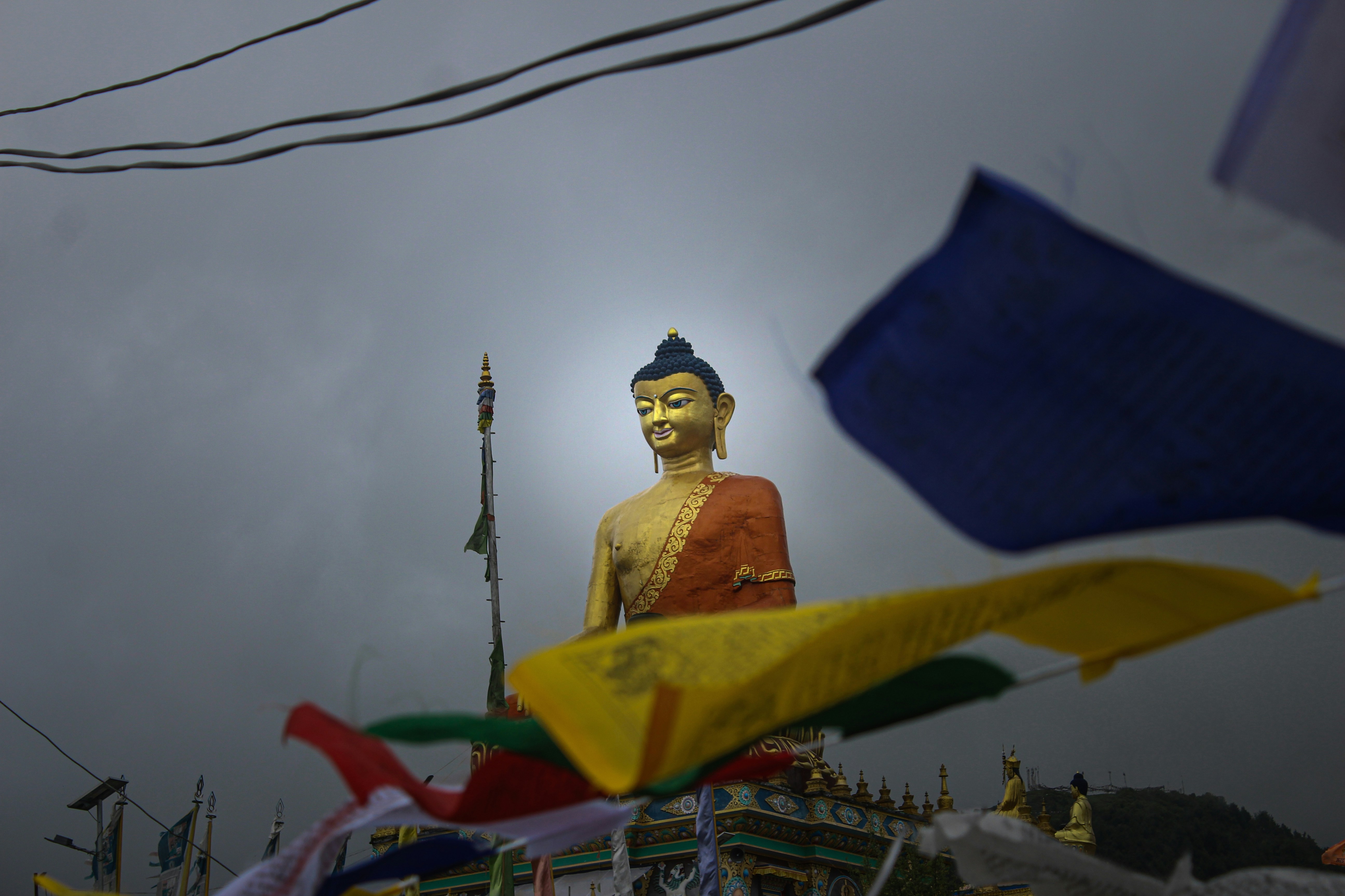 Golden Stature at Prayer Flag Gale