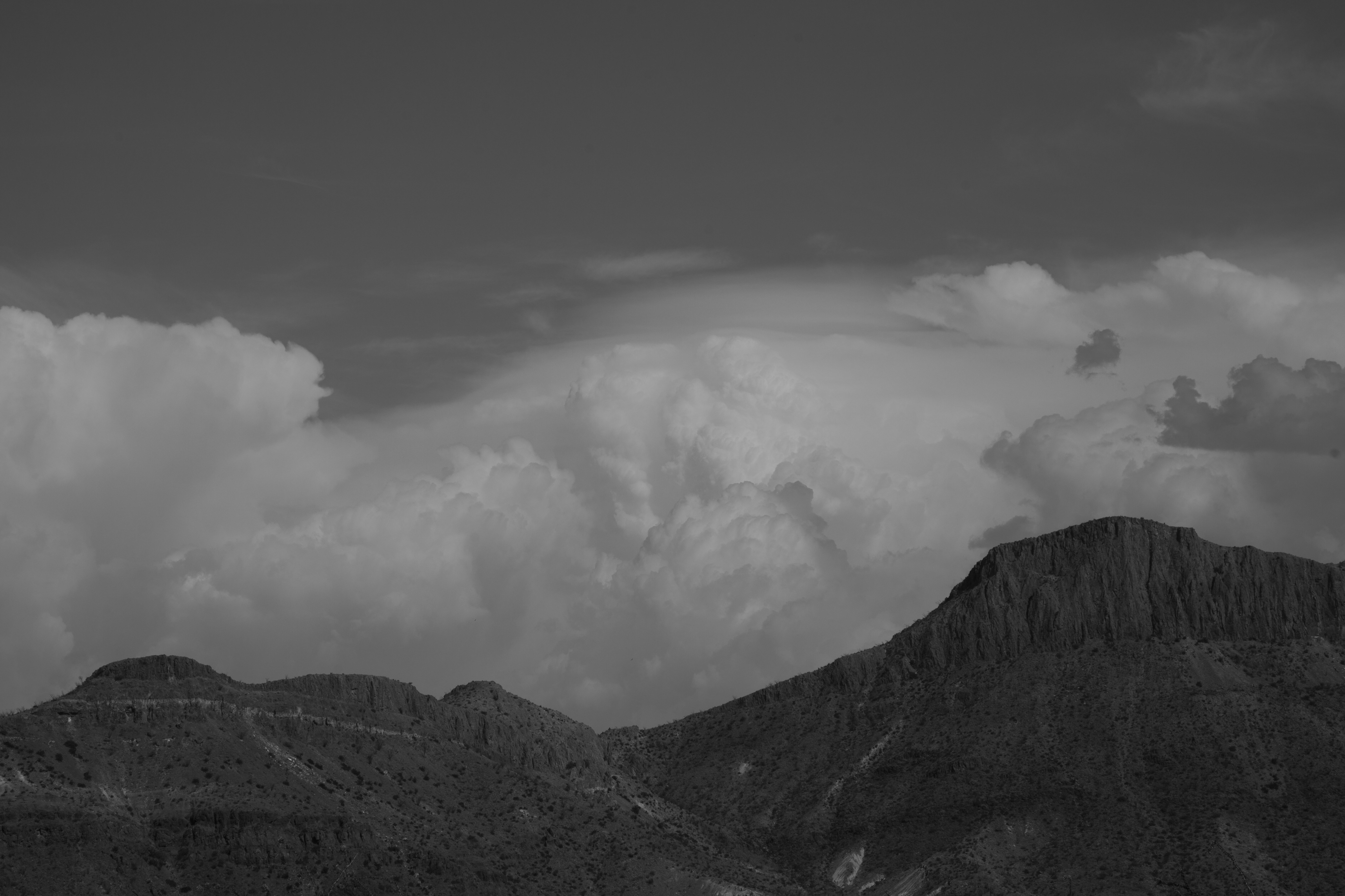 Desert Ridge Under Expansive Cloudscape