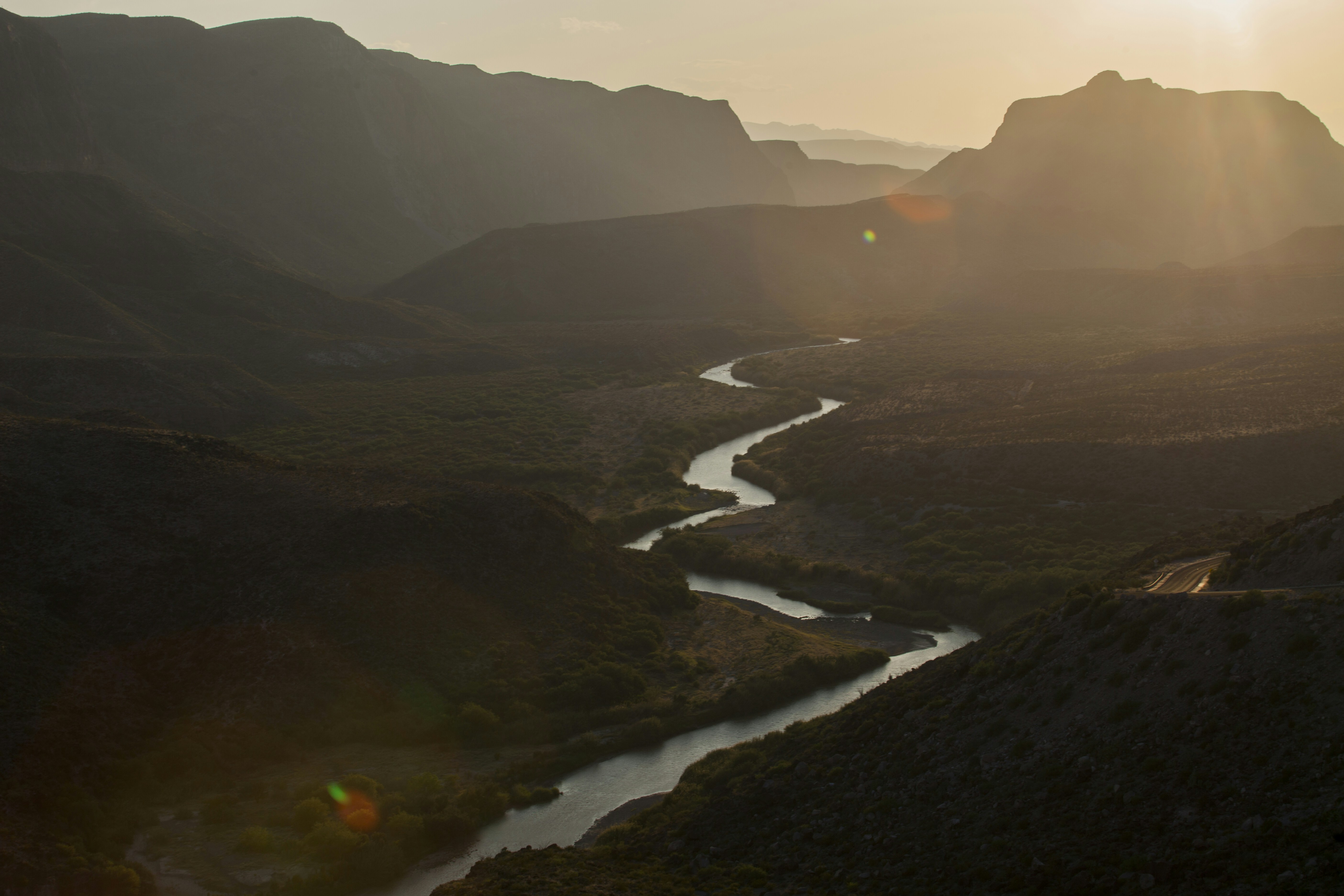 Serpentine River at Dusk Through Desert Vales