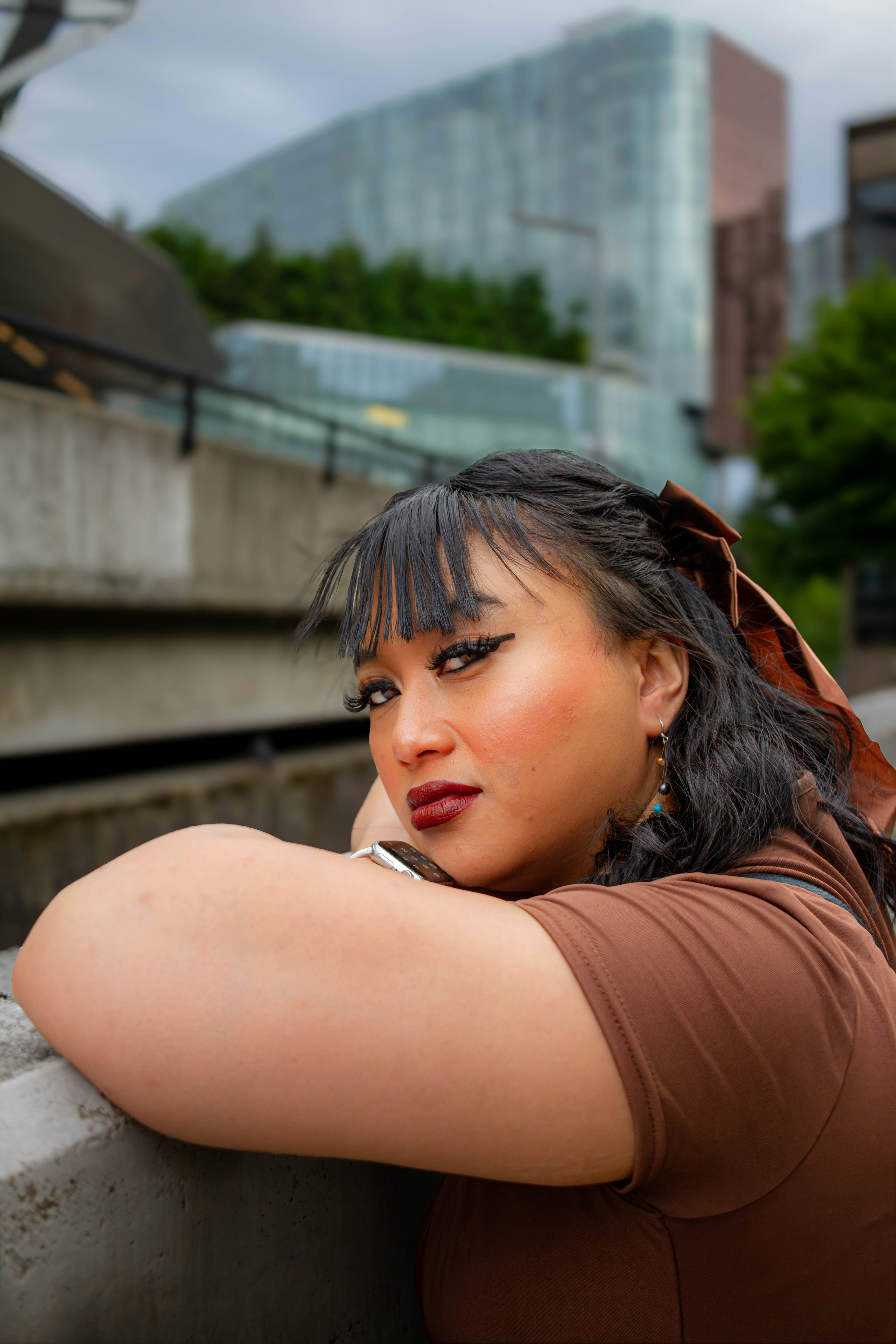 Portrait on the Edge: A Bold Glance Against Urban Concrete