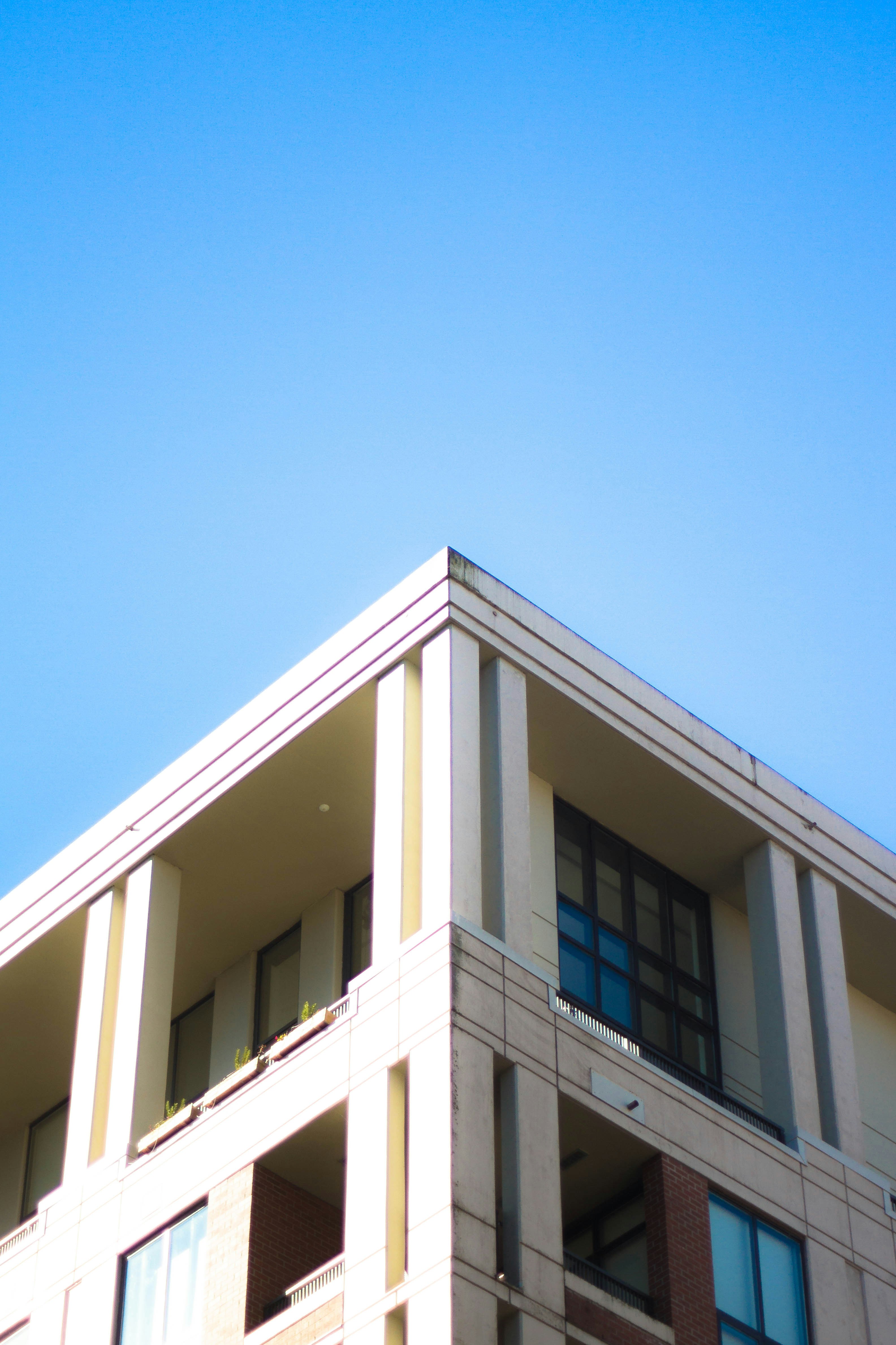 Angular Campus: A Corner of Modernist Facades Against a Clear Sky